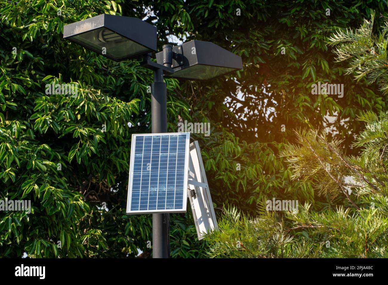 Solar Light. Public city light with solar panel powered on blue sky ...