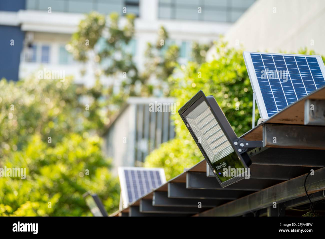 Solar Light. Public city light with solar panel powered on blue sky ...