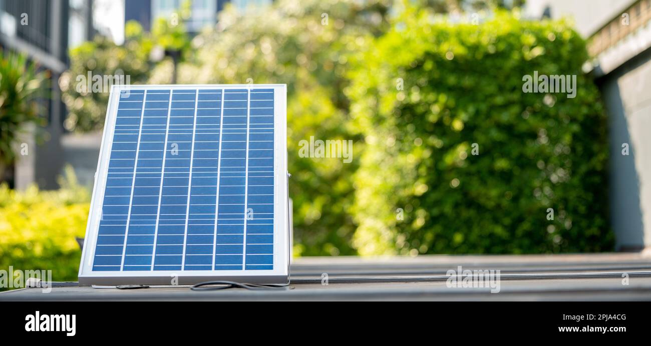 Solar Light. Public city light with solar panel powered on blue sky ...