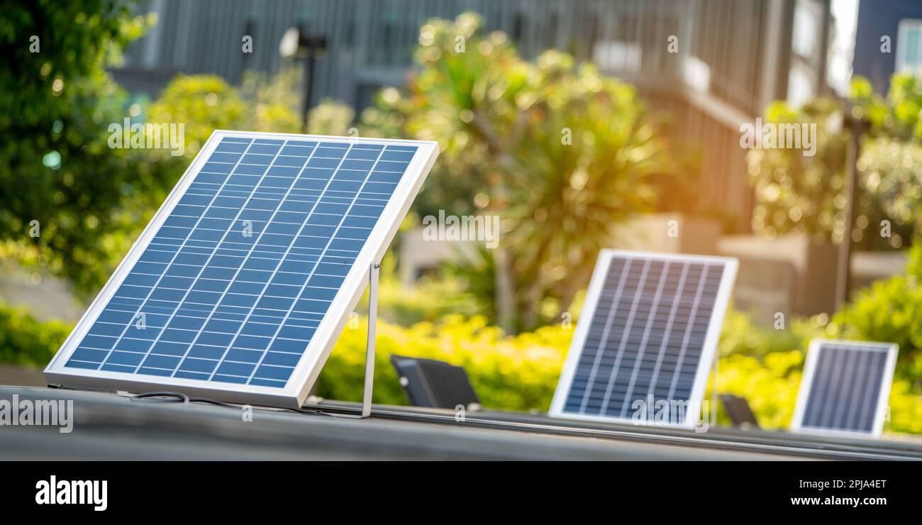 Solar Light. Public city light with solar panel powered on blue sky ...