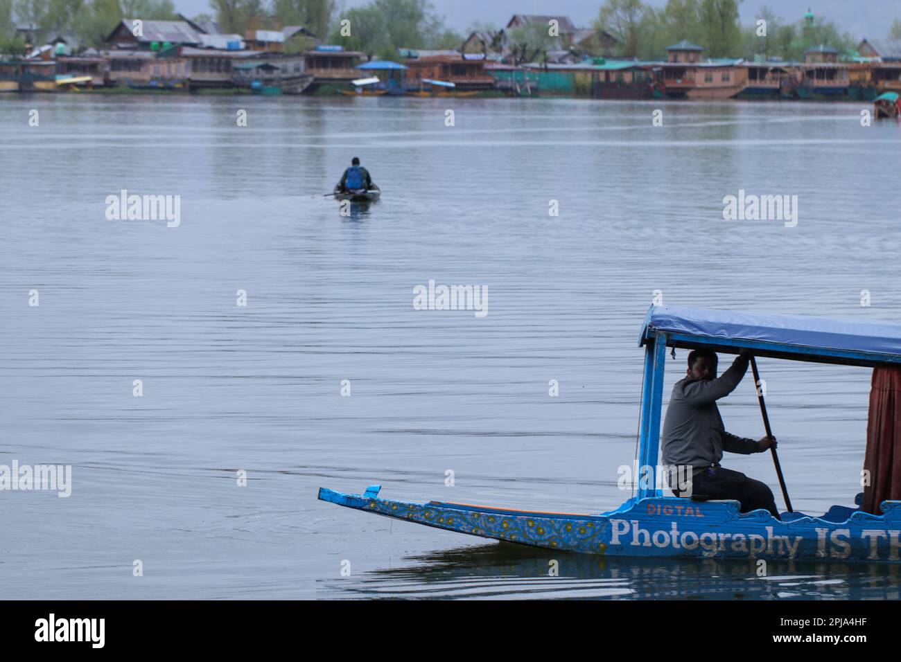 April 1, 2023, Srinagar, Jammu and Kashmir, India: A boatman rows his ...