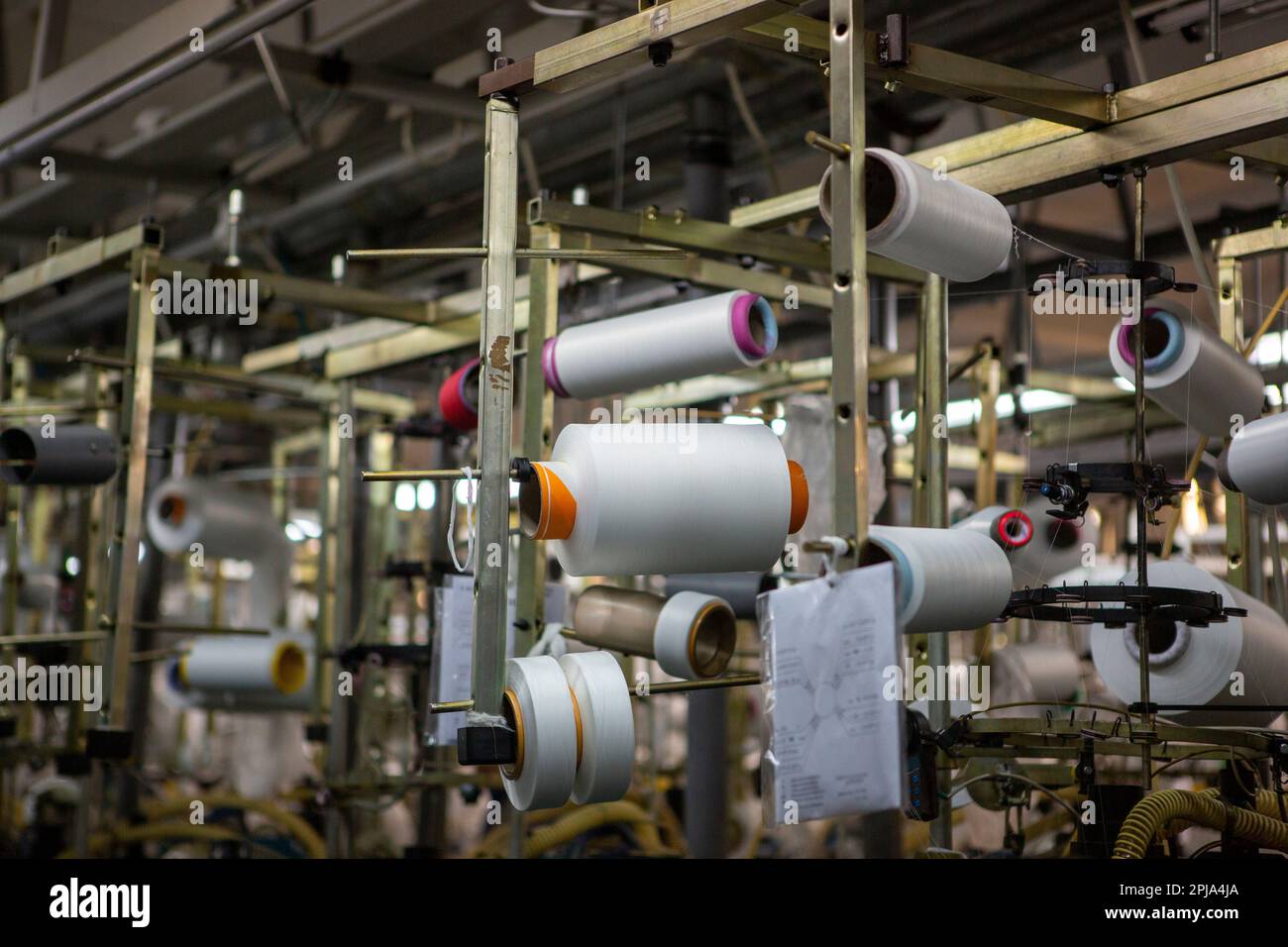 Textile industry with knitting machines in factory. Textile industry ...