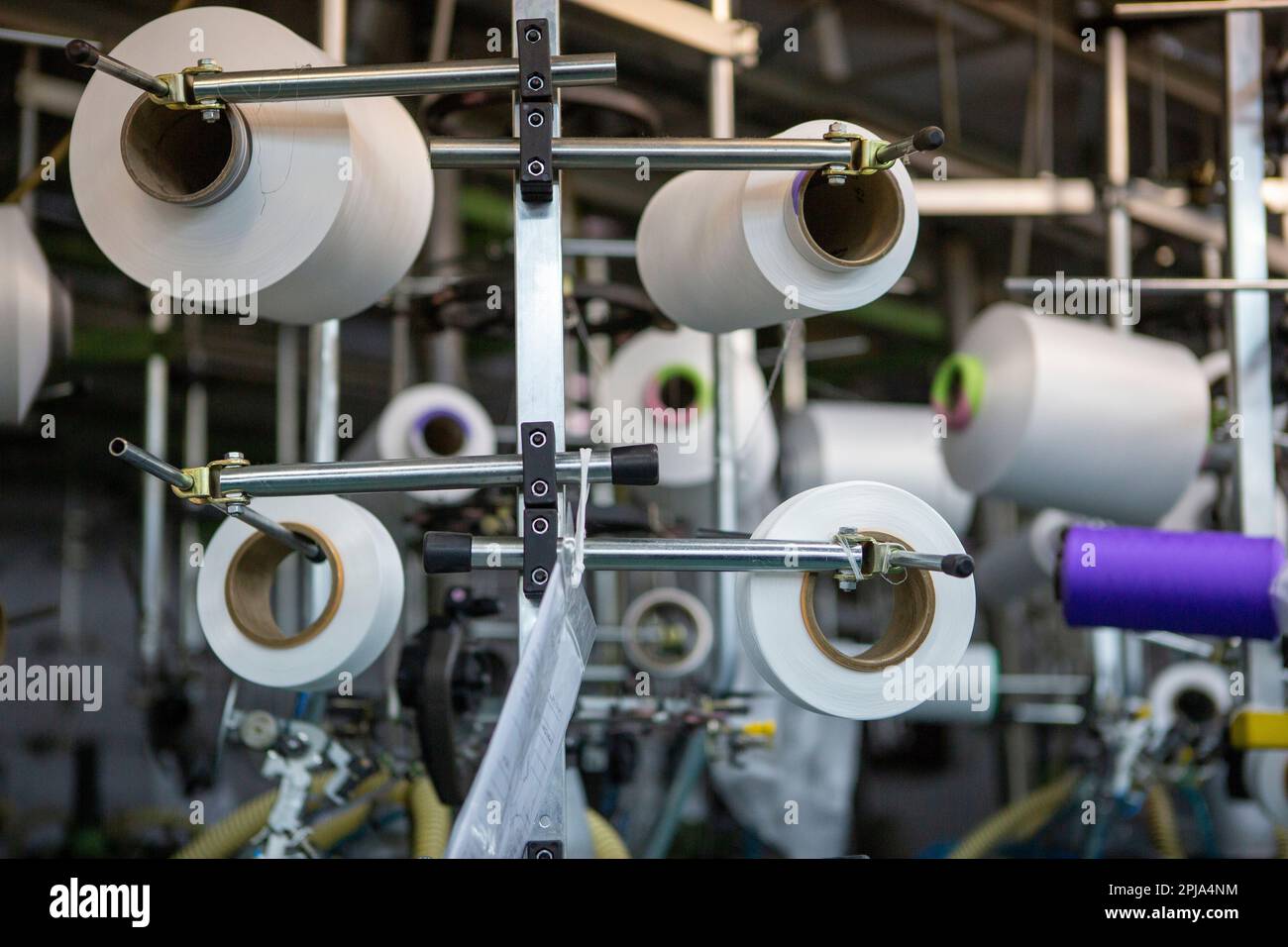 Textile industry with knitting machines in factory. Textile industry ...