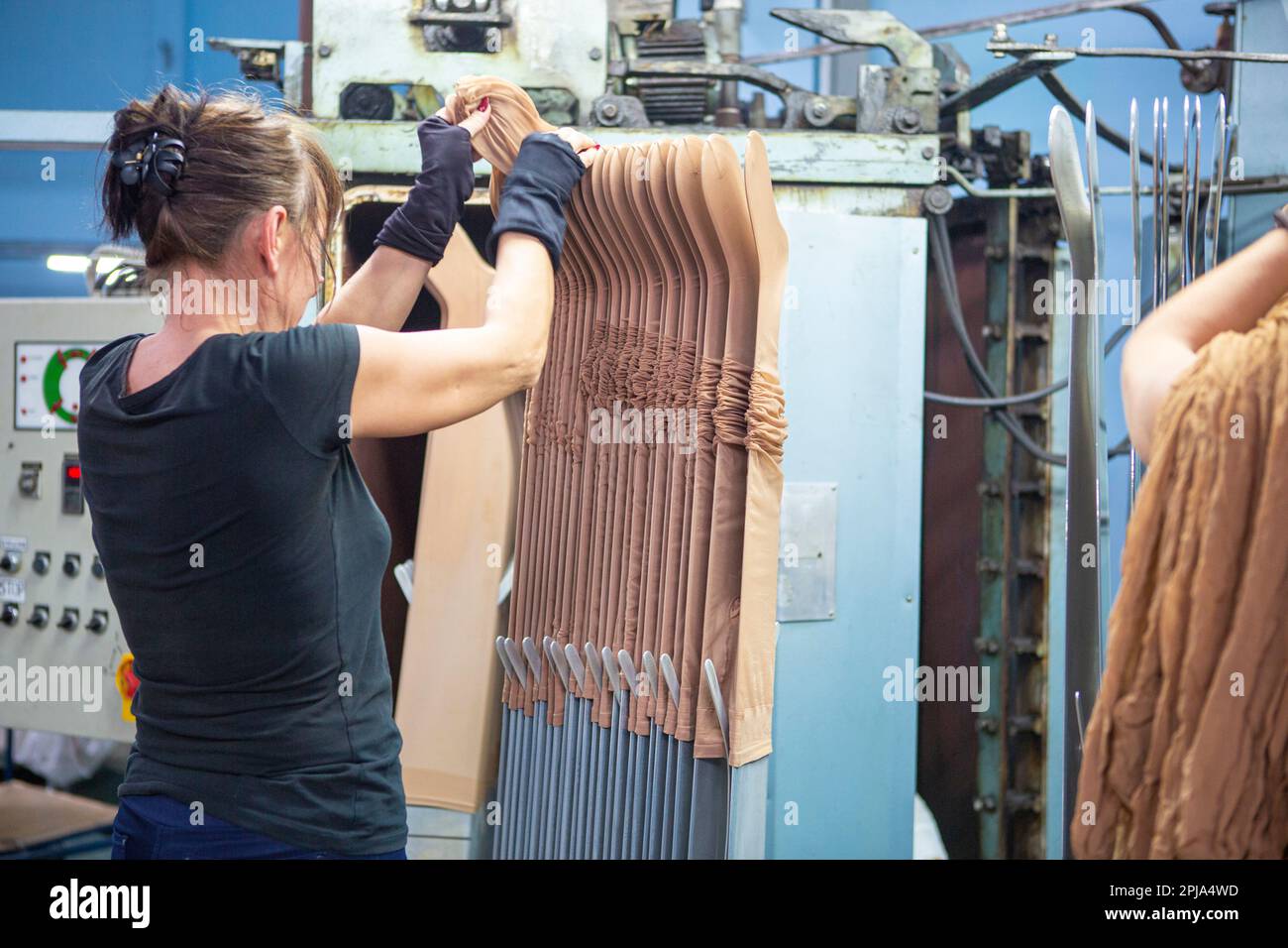 production of capron tights. Textile factory with machines and ...