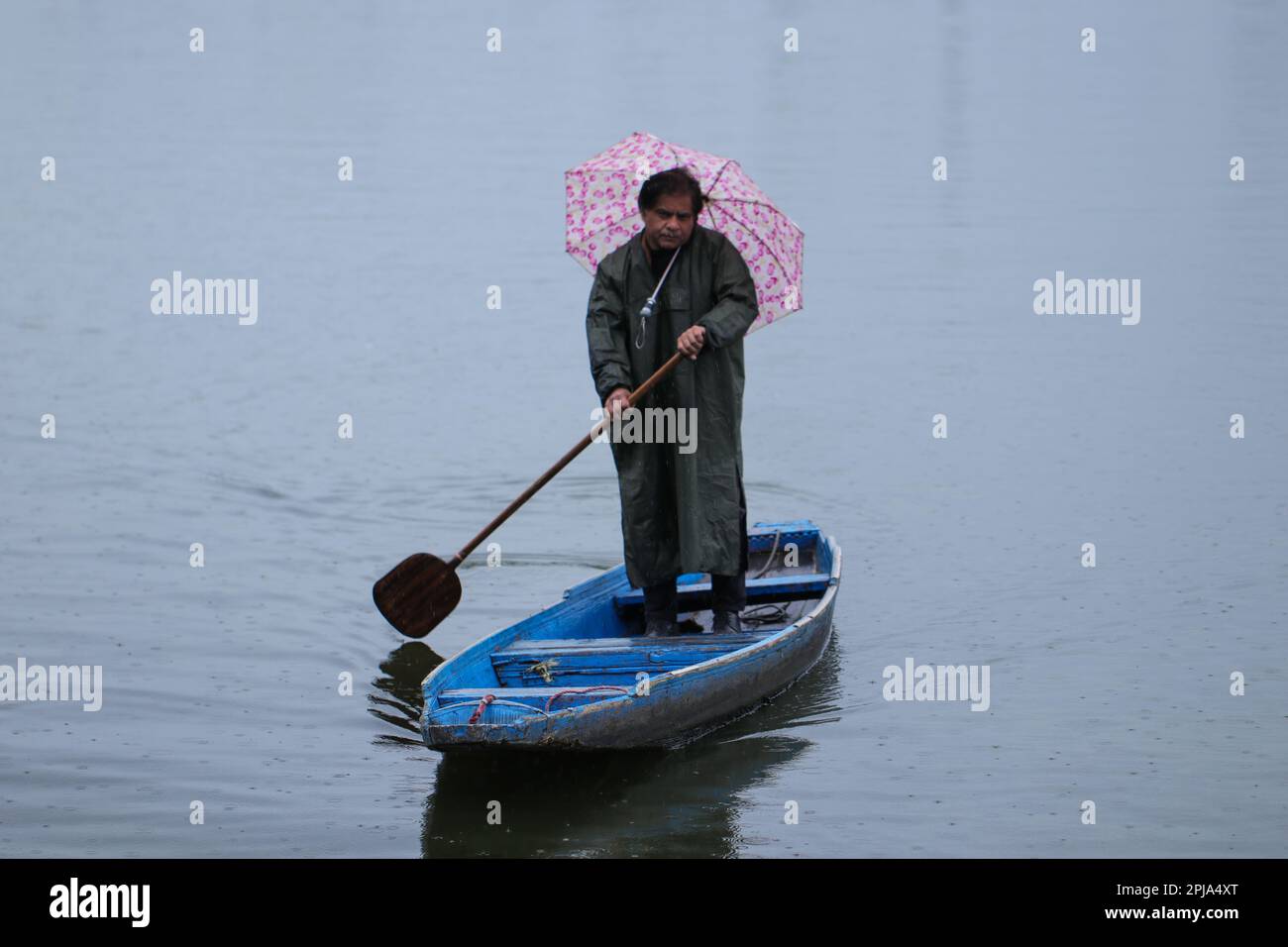 April 1, 2023, Srinagar, Jammu and Kashmir, India: A boatman rows his ...