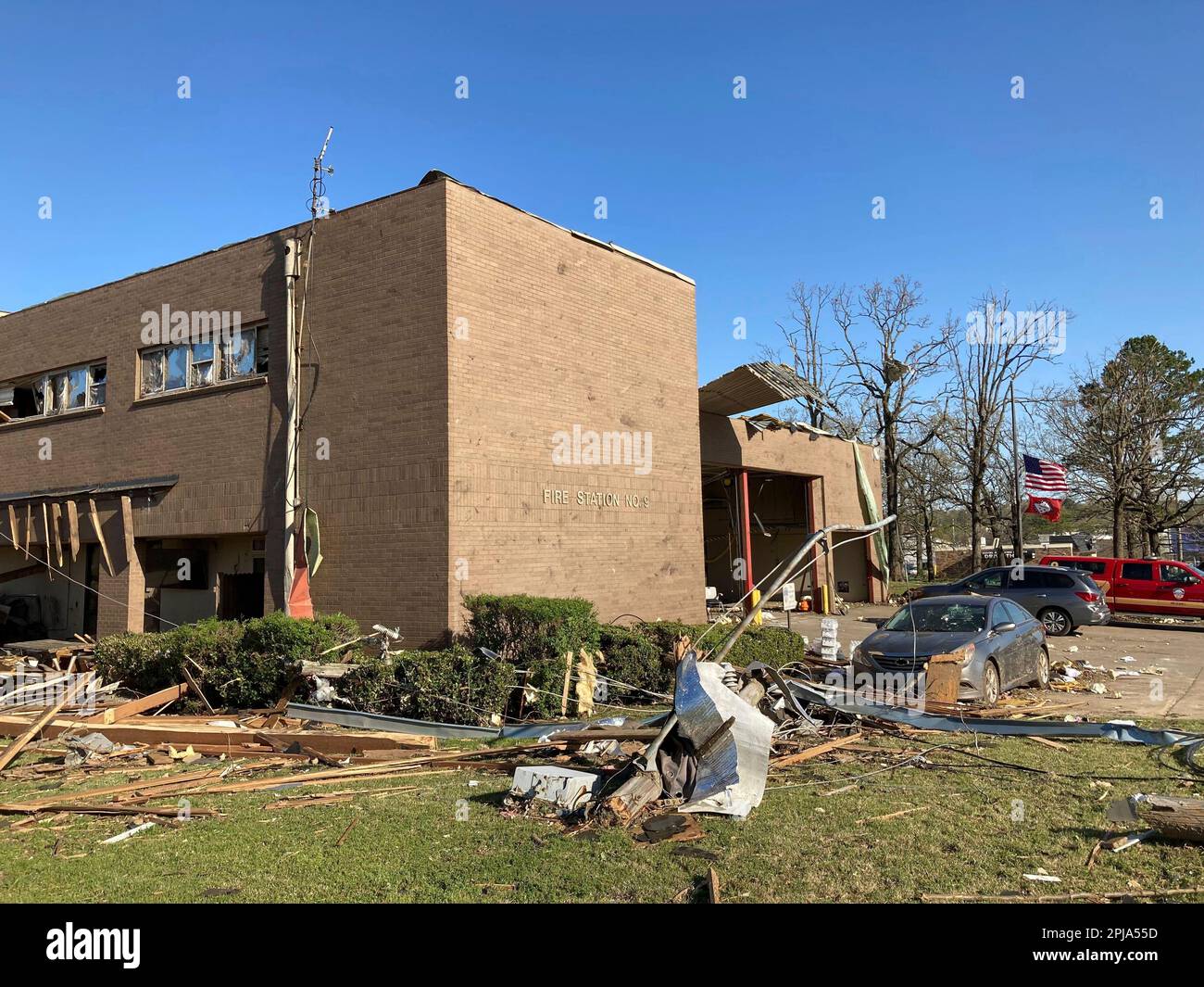 Debris covers the ground around a damaged fire station in Little Rock ...