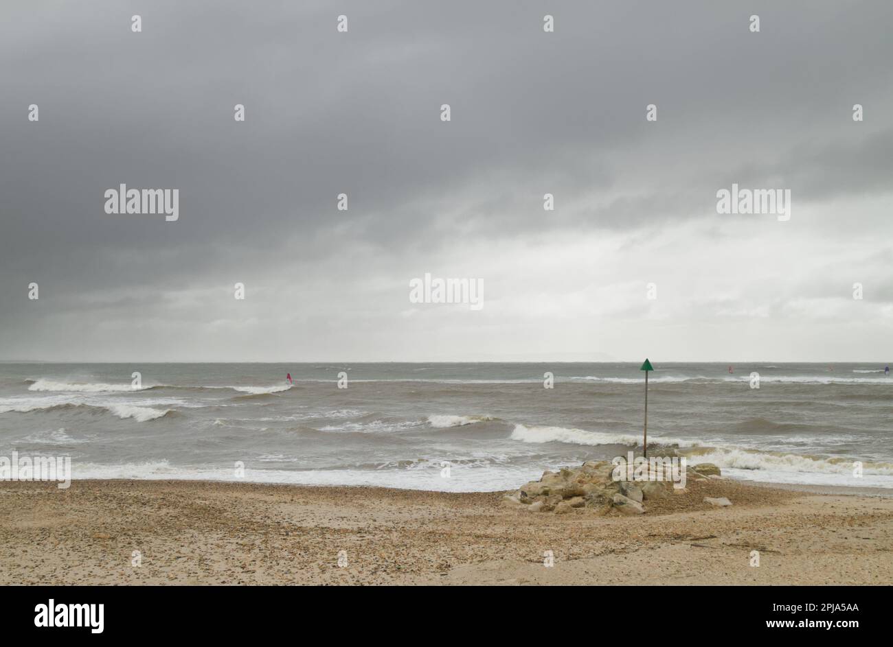 Windsurfers Out To Sea On A Windy Day On Avon Beach Christchurch, UK ...