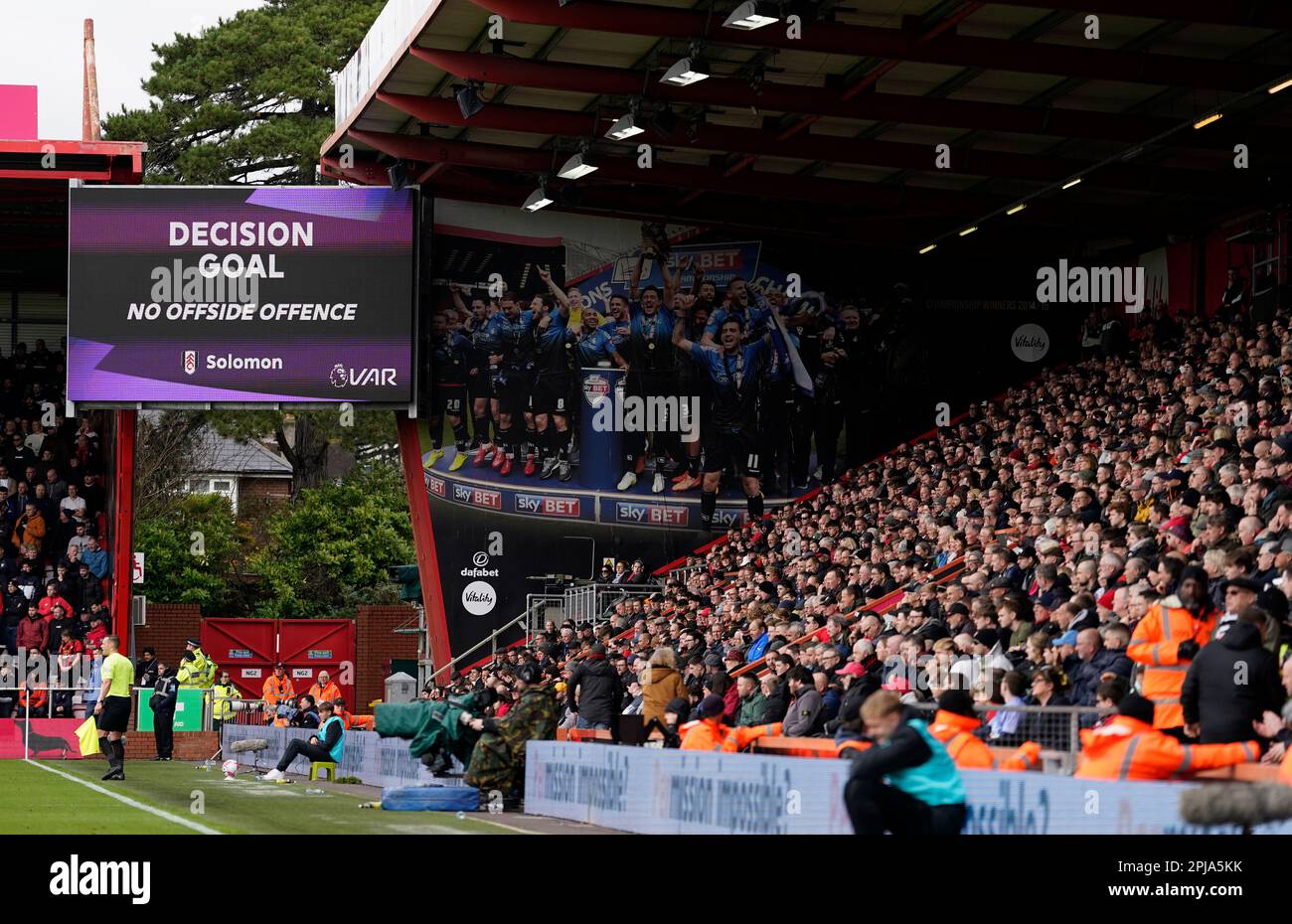 The big screen shows the result of the VAR review on the first goal ...