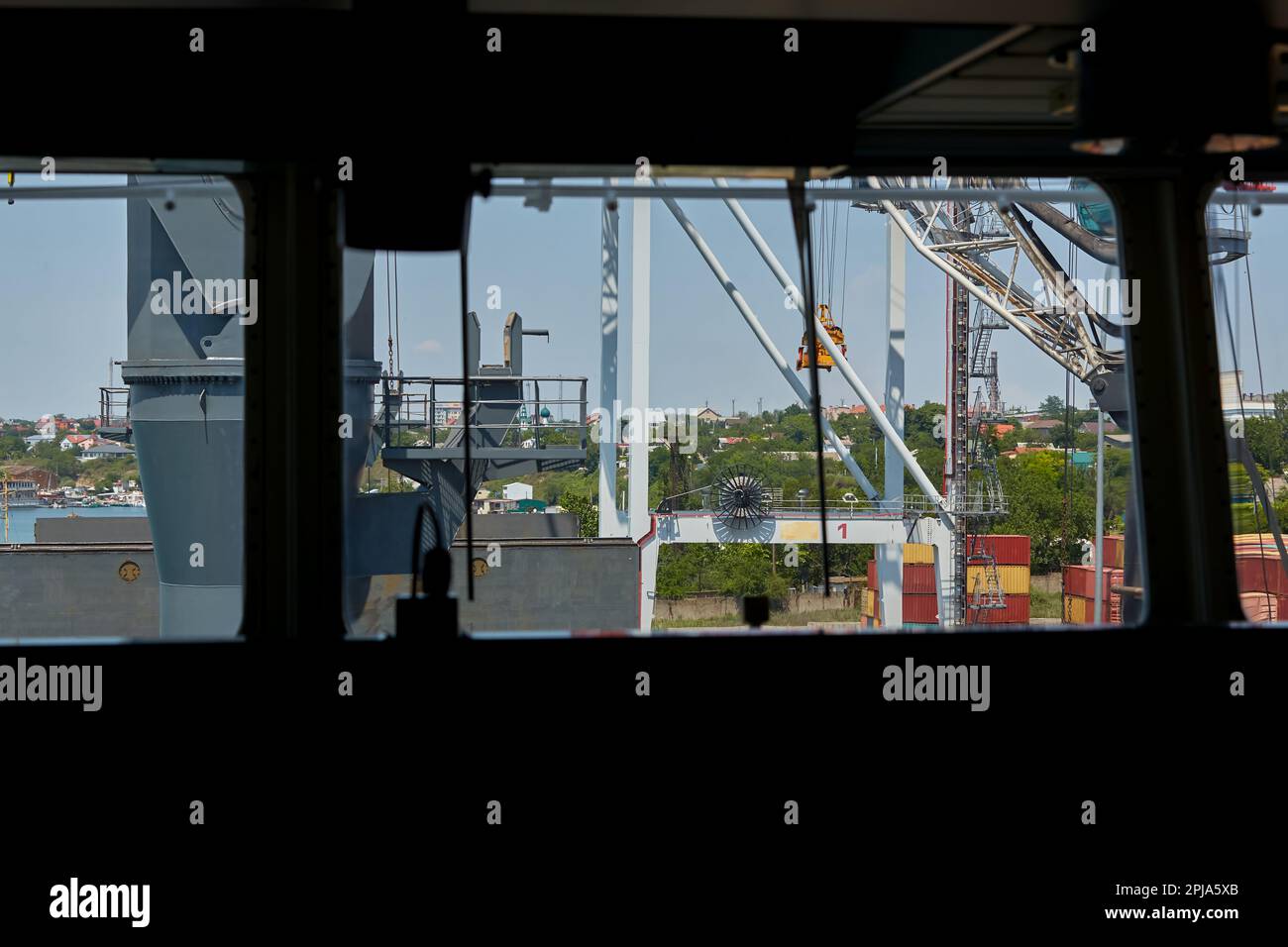 View from bulk carrier's captain's bridge to bulk cargo berth. View of ...