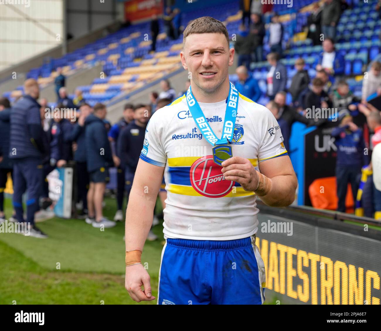 George Williams #6 of Warrington Wolves shows off his Player of the ...