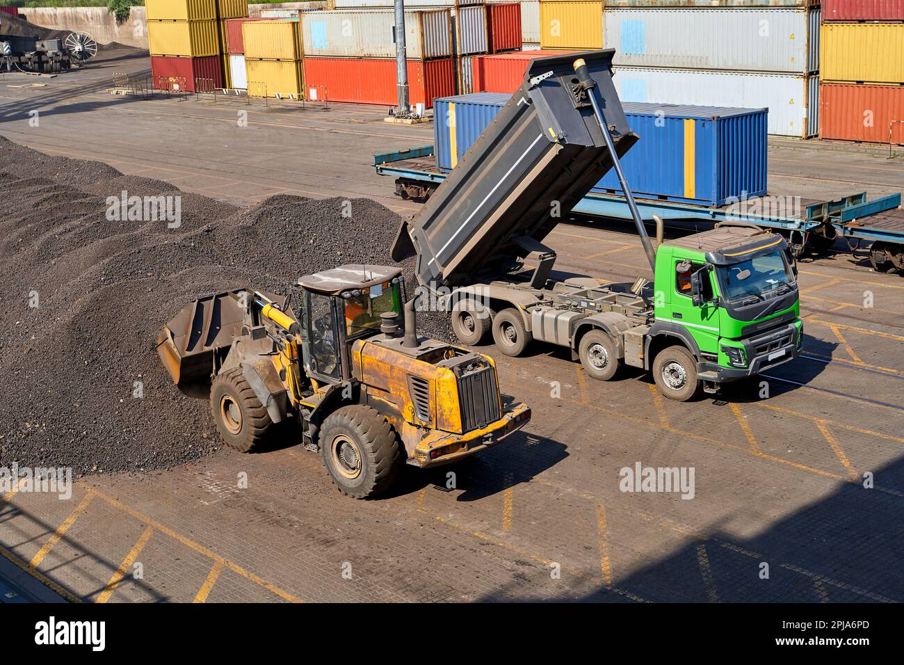Operations with coal in seaport. Loading coal on bulk carrier. Coal ...
