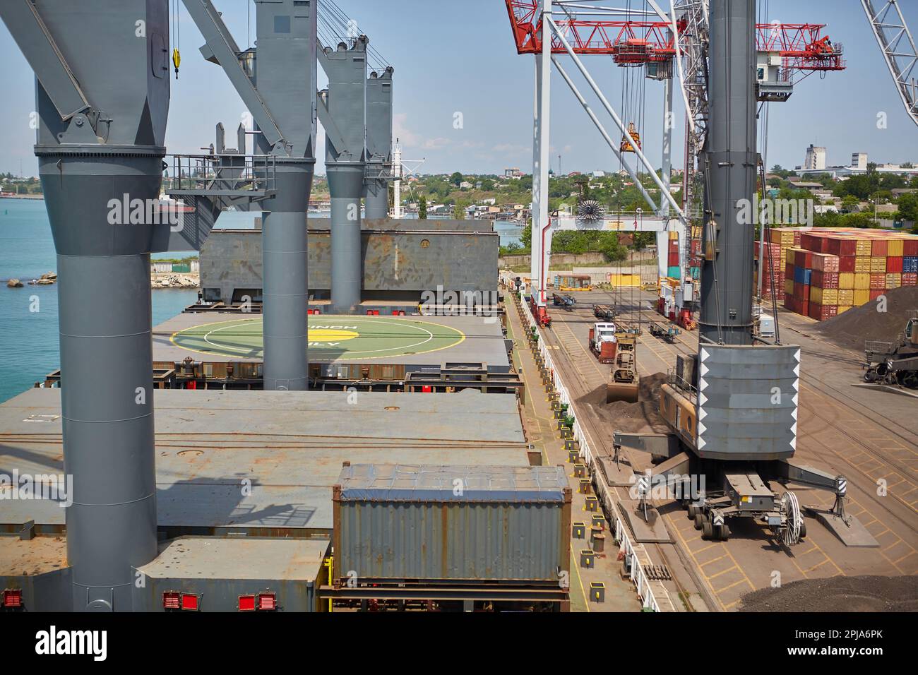Operations with coal in seaport. Loading coal on bulk carrier. Coal ...