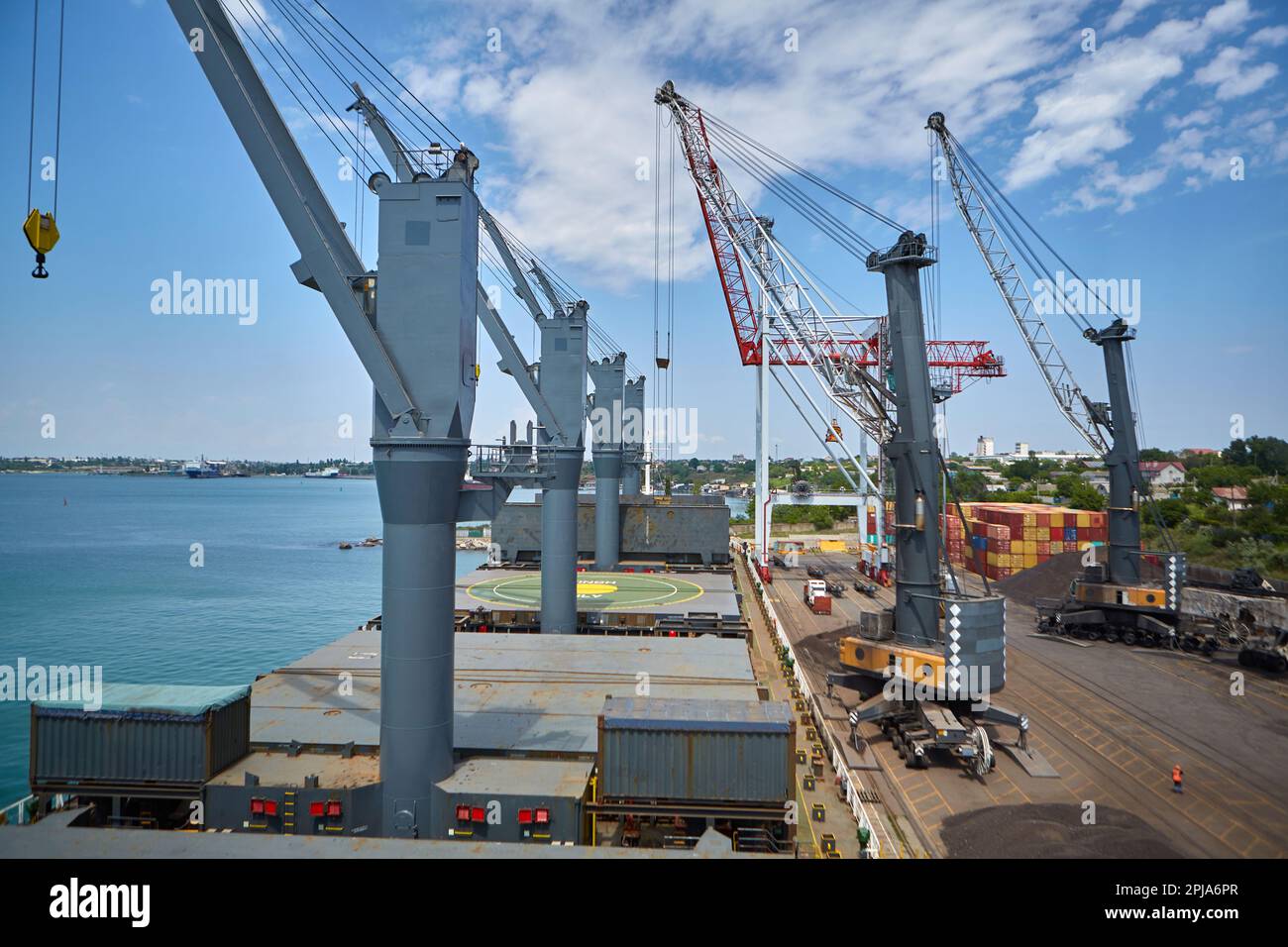 Operations with coal in seaport. Loading coal on bulk carrier. Coal ...