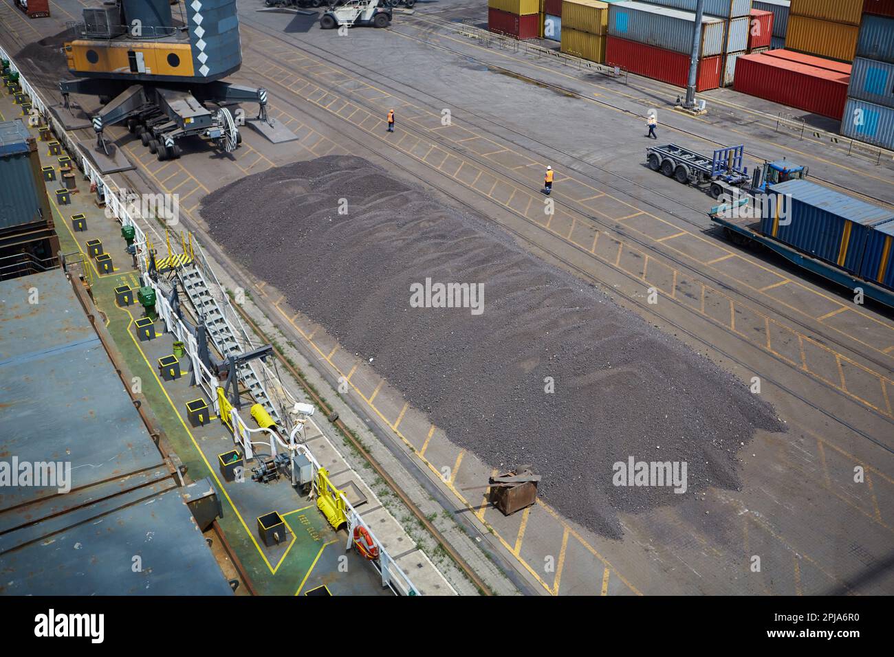 Operations with coal in seaport. Loading coal on bulk carrier. Coal ...