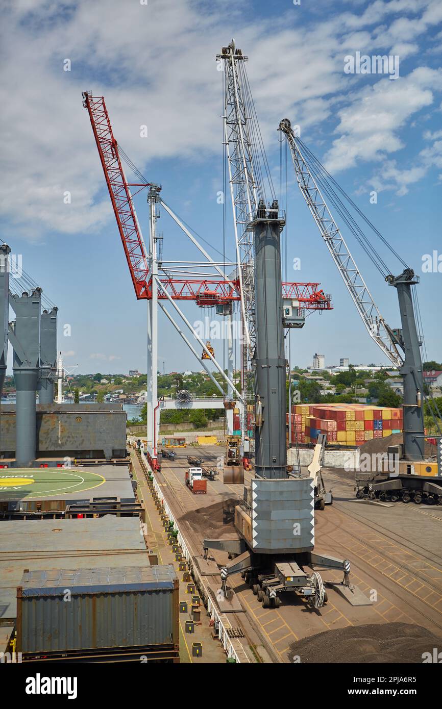Operations with coal in seaport. Loading coal on bulk carrier. Coal ...