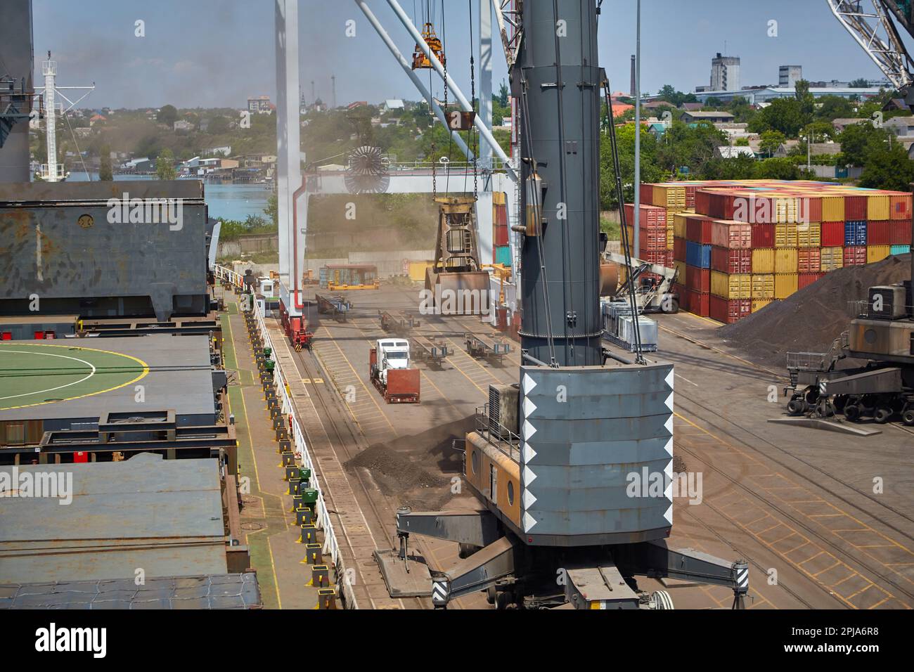 Operations with coal in seaport. Loading coal on bulk carrier. Coal ...