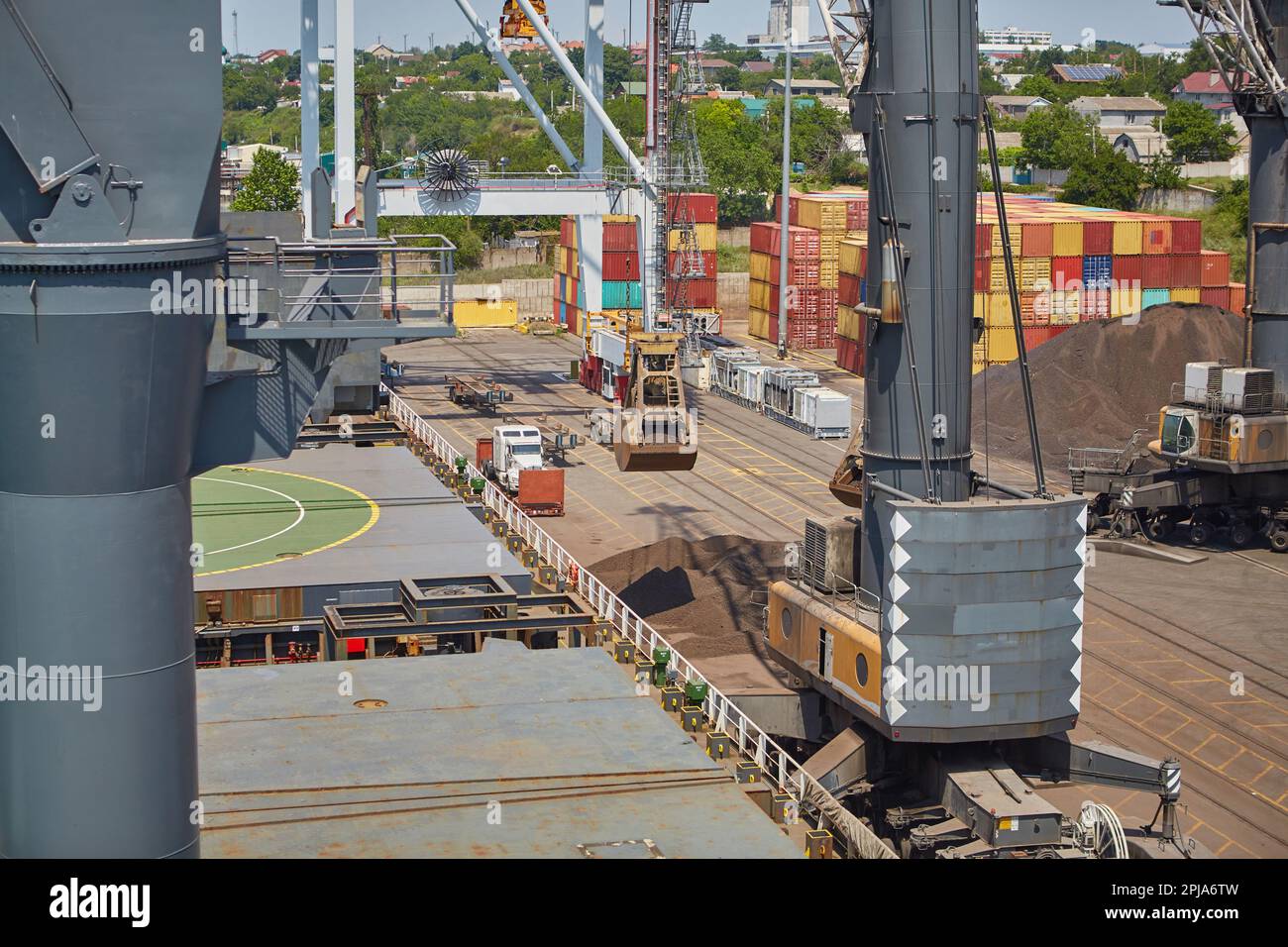 Operations with coal in seaport. Loading coal on bulk carrier. Coal ...