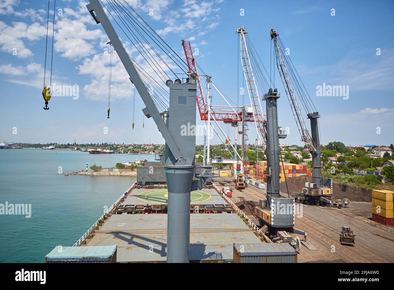 Operations with coal in seaport. Loading coal on bulk carrier. Coal ...