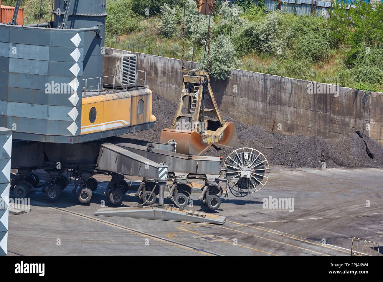 Operations with coal in seaport. Loading coal on bulk carrier. Coal ...
