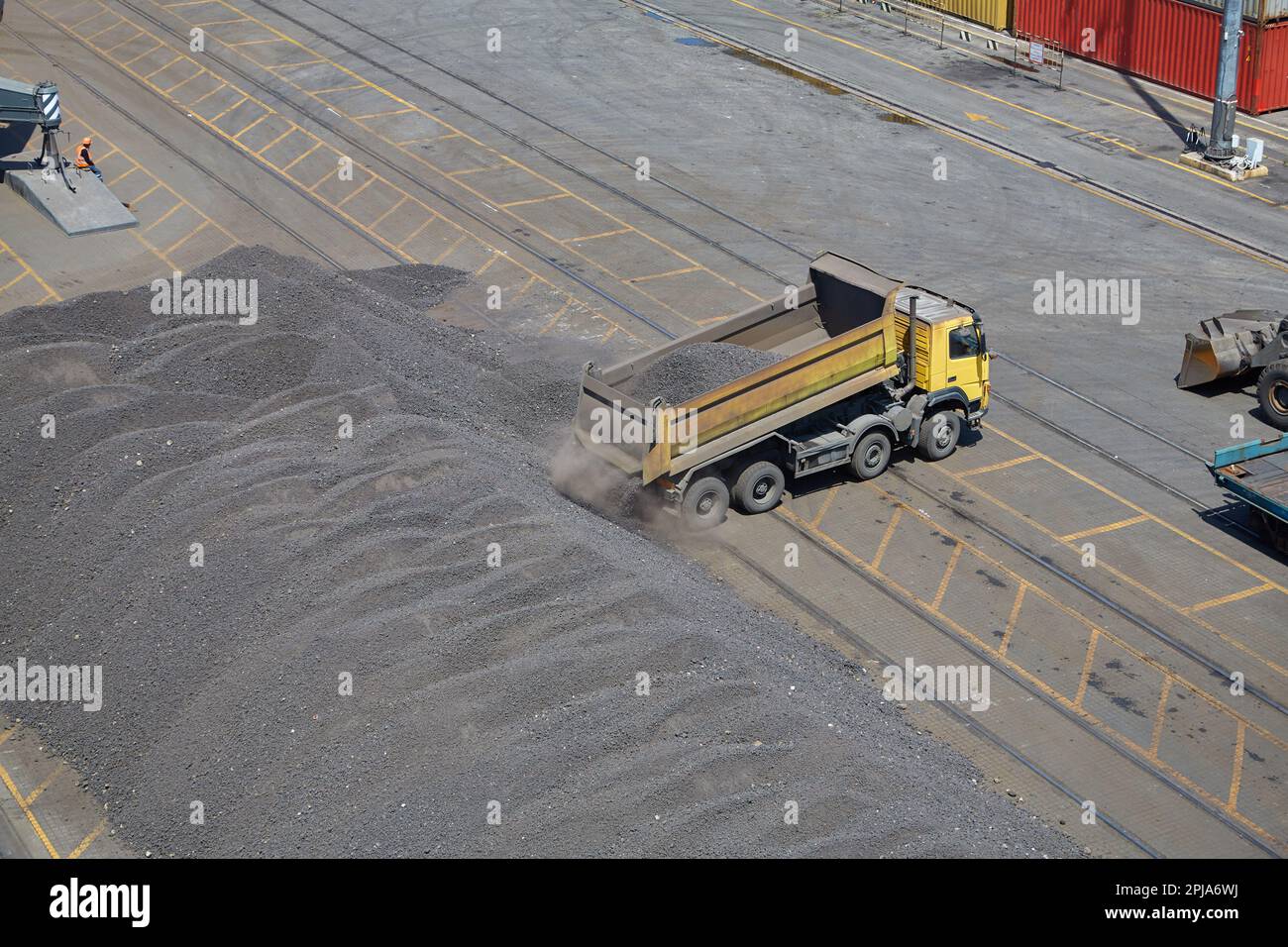 Operations with coal in seaport. Loading coal on bulk carrier. Coal ...