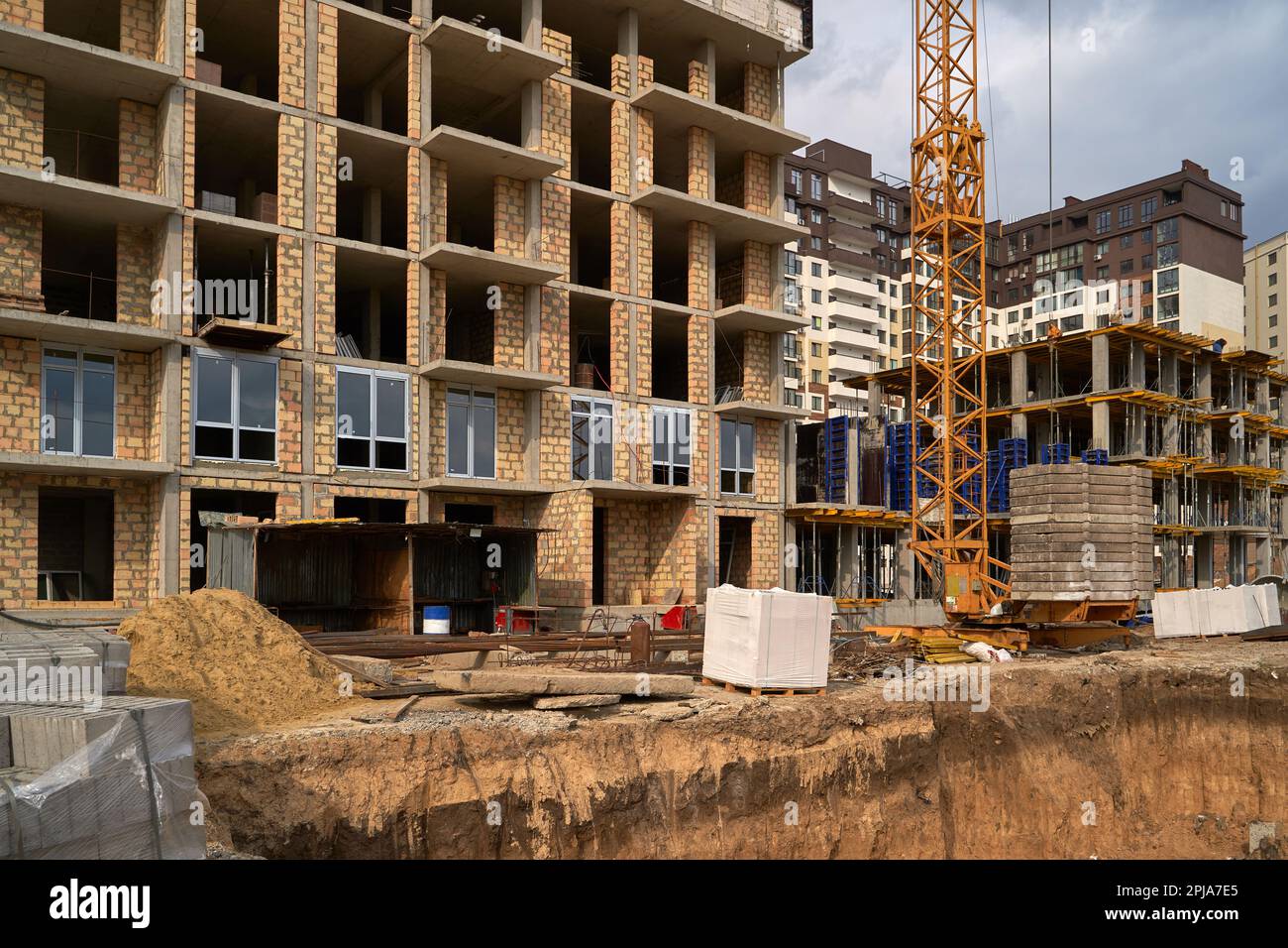 Construction site. High rise Building under construction. Construction ...