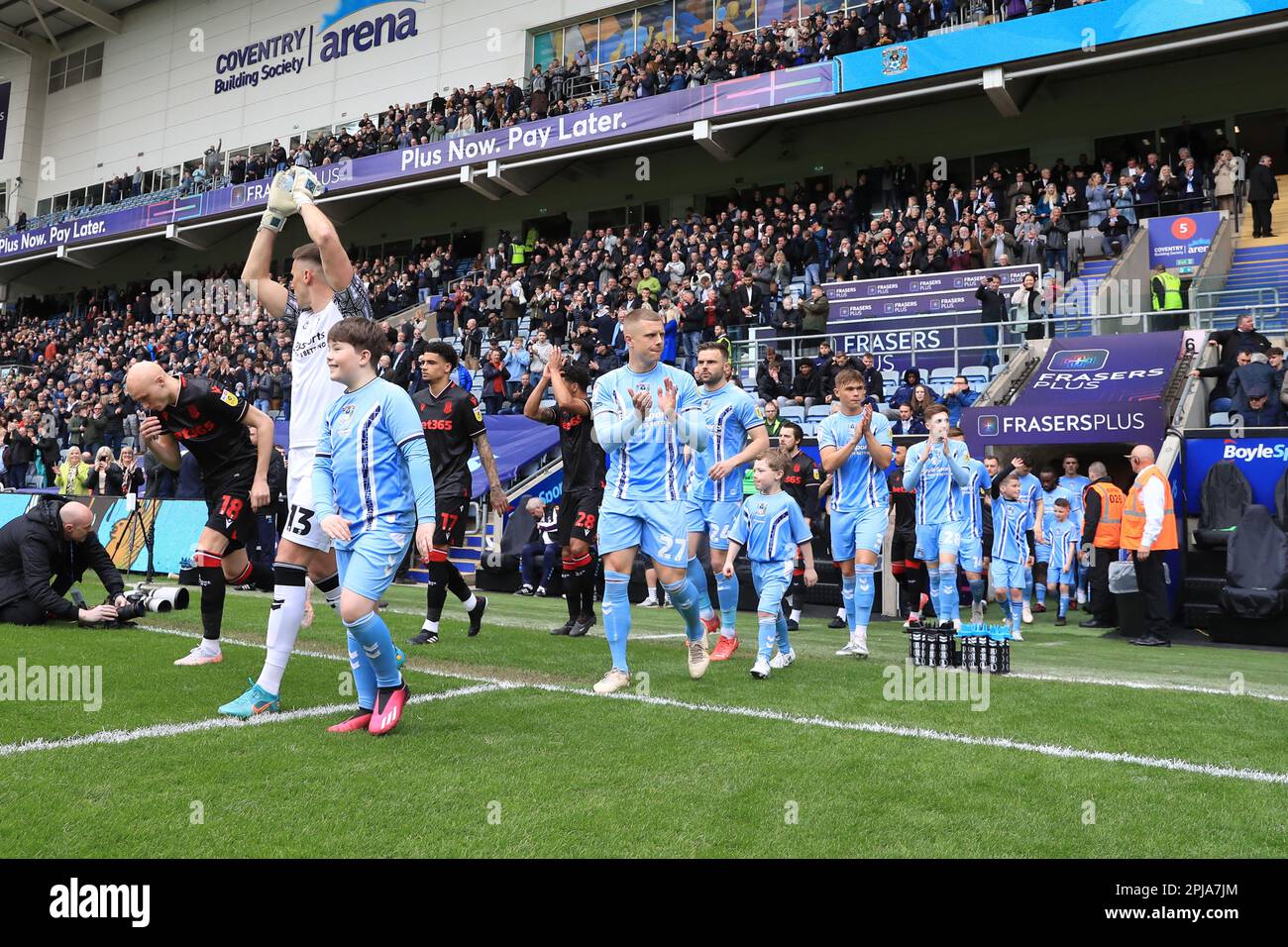 Coventry City goalkeeper Ben Wilson (2nd-left) walking onto the pitch ...