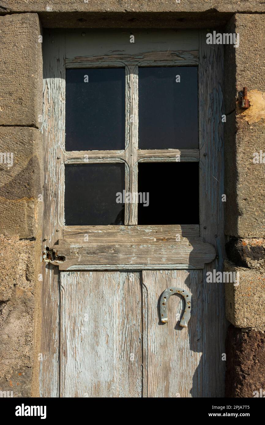 Lucky horseshoe on a wooden door. Auvergne. France Stock Photo - Alamy
