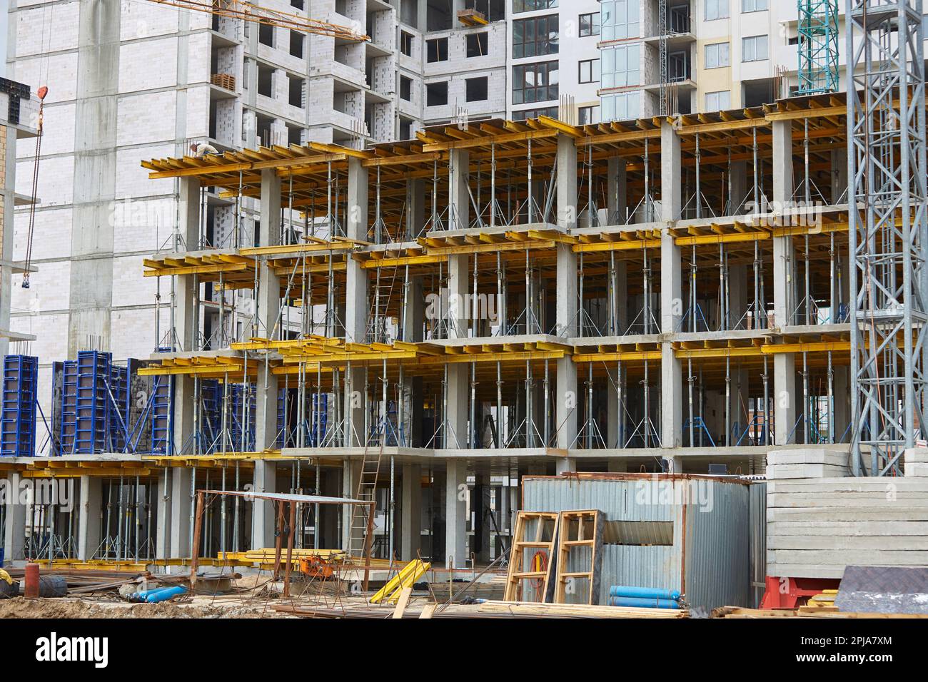 Construction site. High rise Building under construction. Construction ...