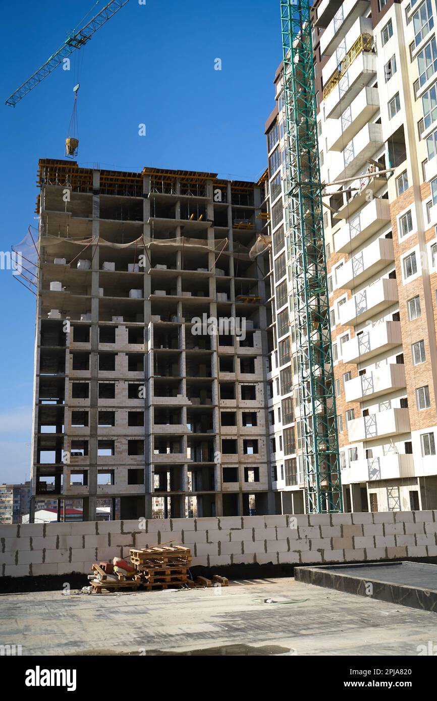 Construction site. High rise Building under construction. Construction ...