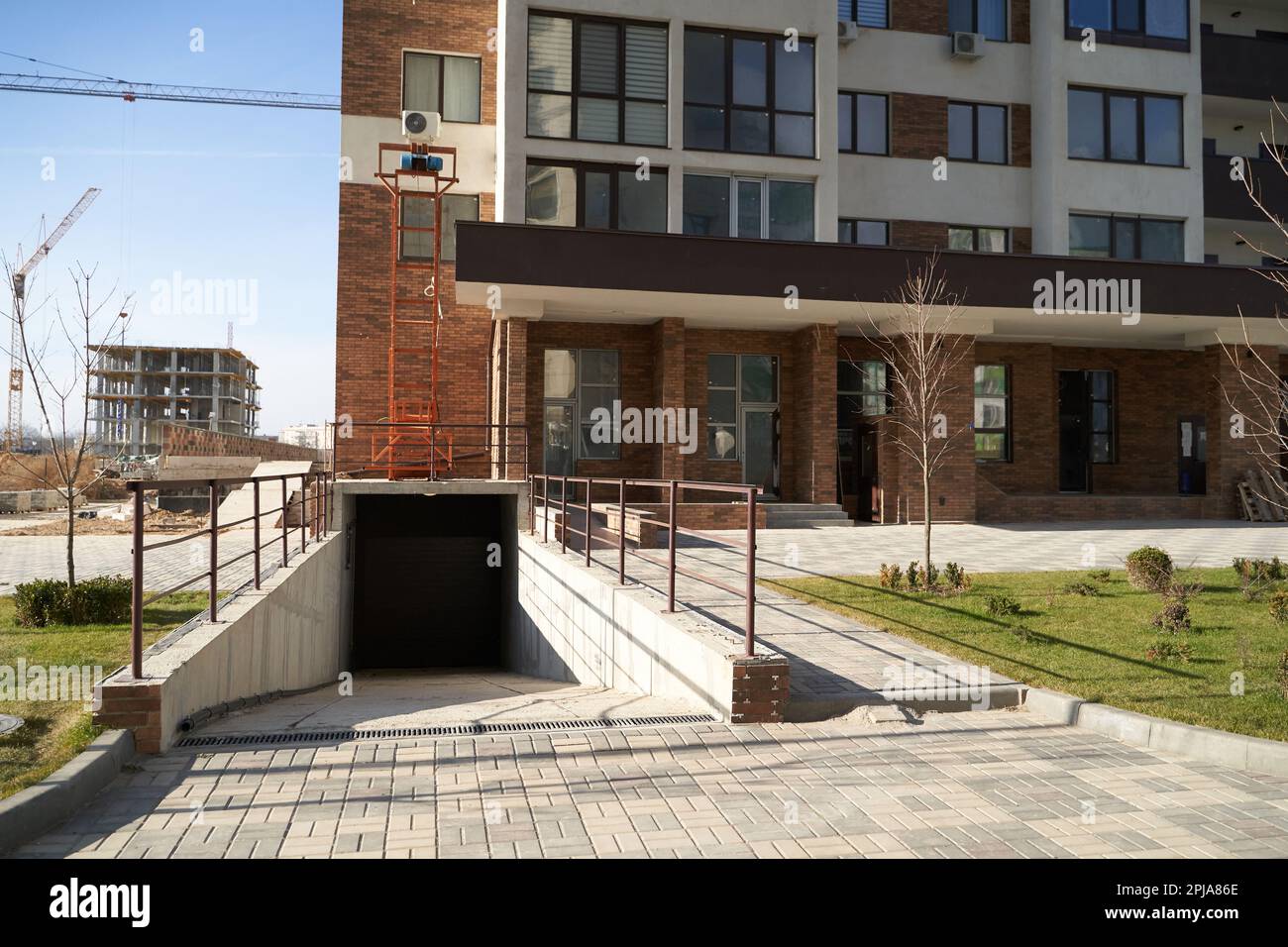 The entrance to the underground parking of the apartment building Stock ...