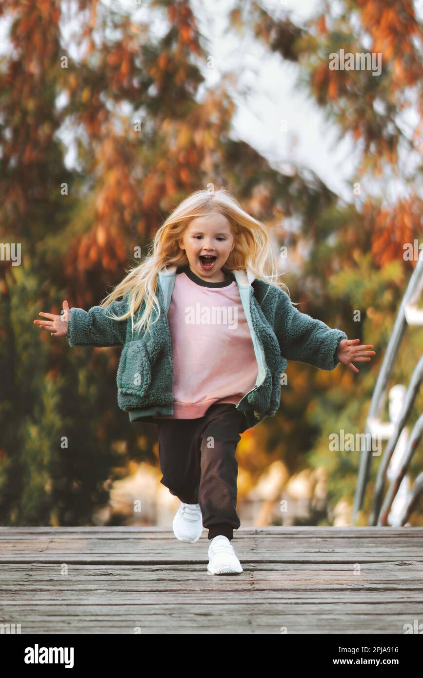 Child running in a park happy laughing travel vacations outdoor family ...