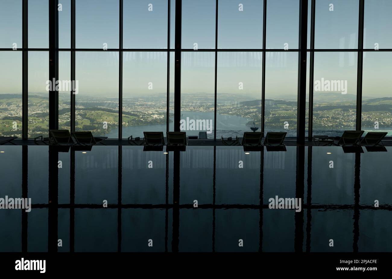 Infinity Swimming Pool with Window View over City and Lake Lucerne in ...