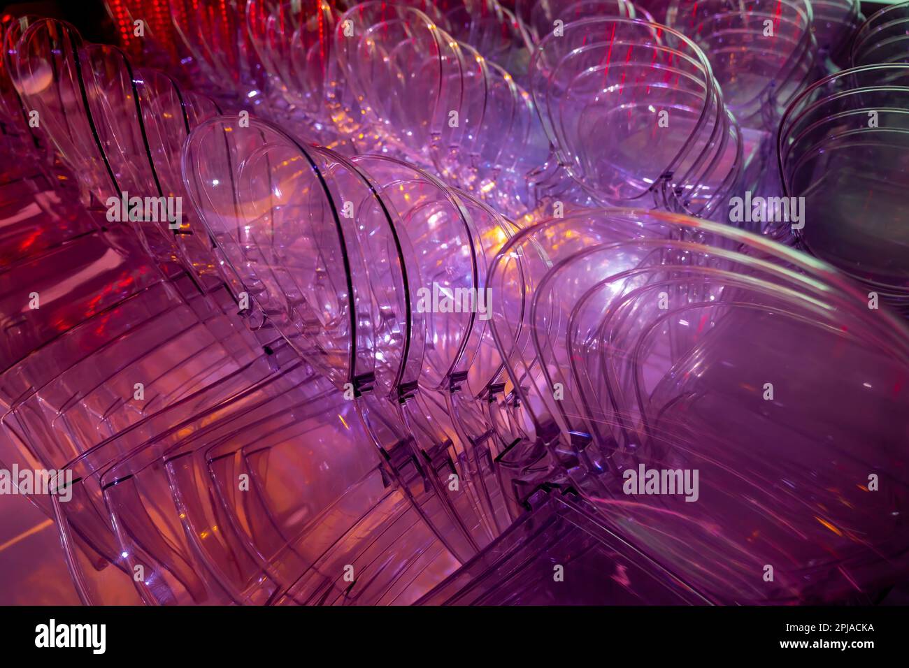 Abstract red plastic chairs hi-res stock photography and images - Alamy