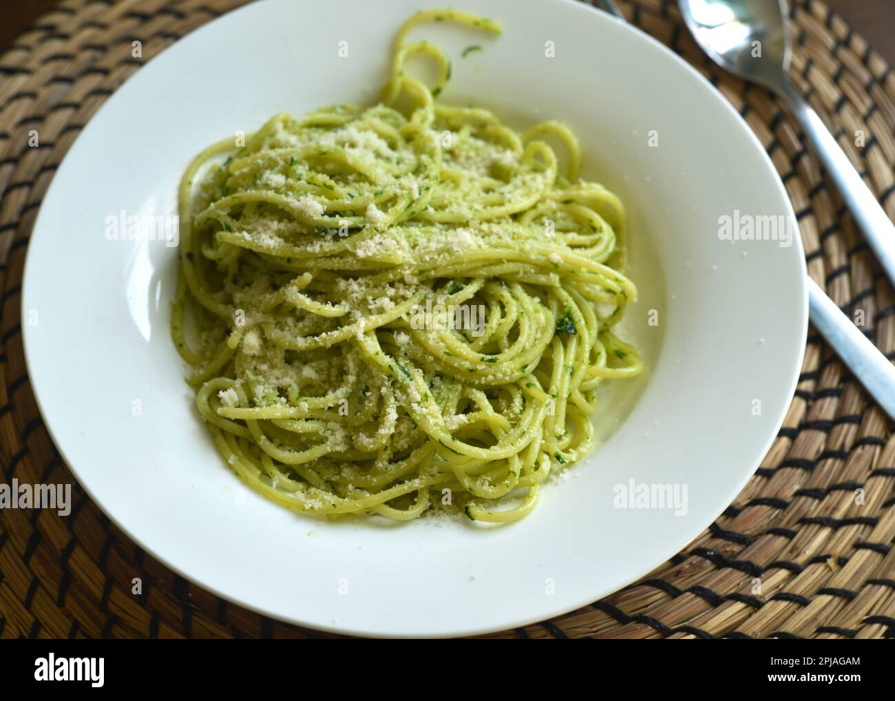 Plate with Spaghetti with wild garlic pesto and cheese Stock Photo - Alamy