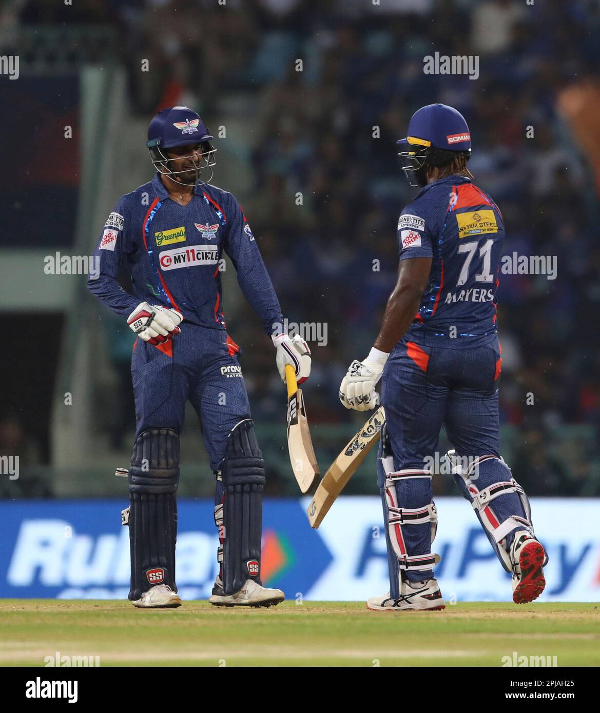 Deepak Hooda of Lucknow Super Giants, left, and Kyle Mayers encourage ...