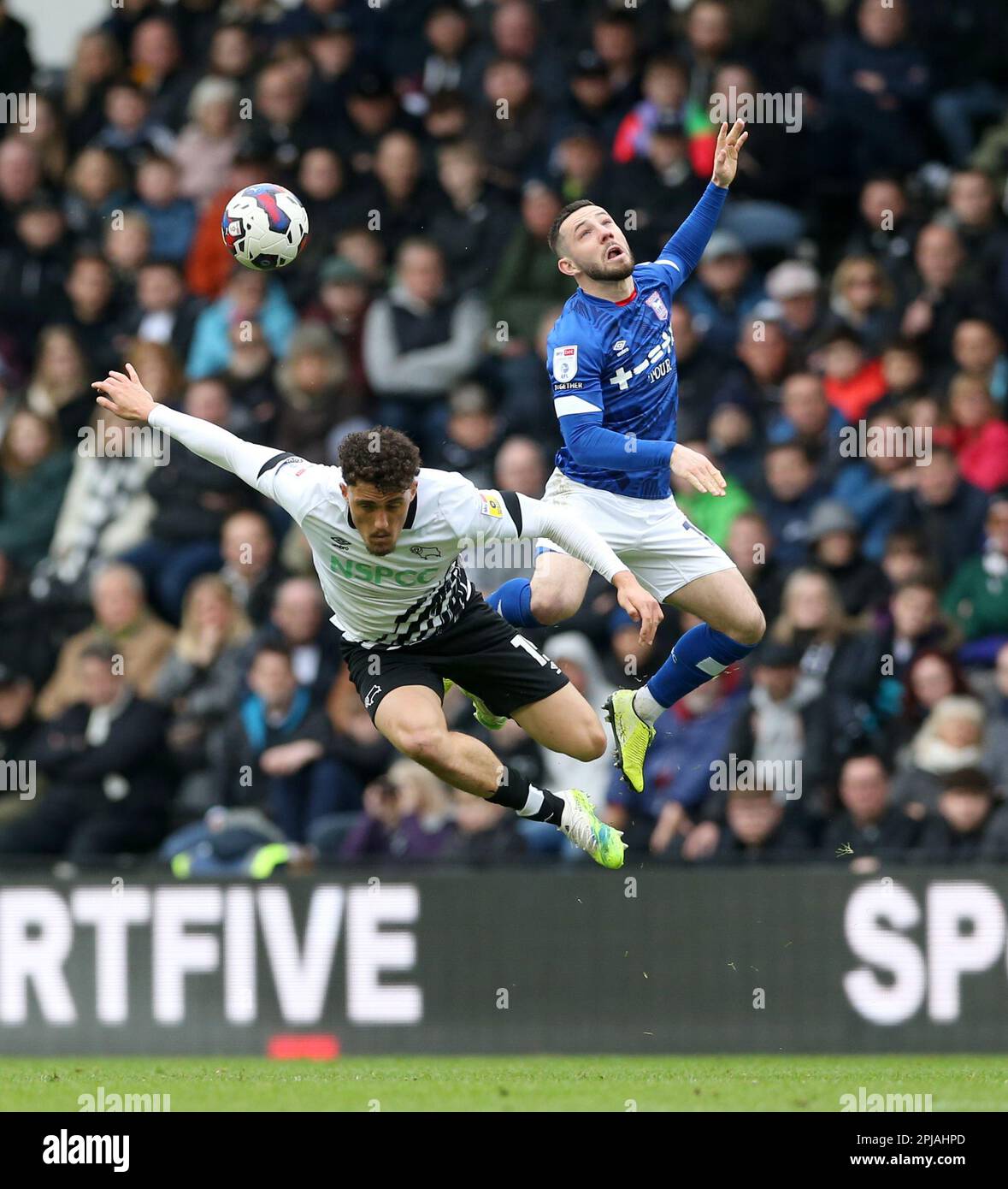 Derby County's Haydon Roberts (left) and Ipswich Town's Conor Chaplin ...