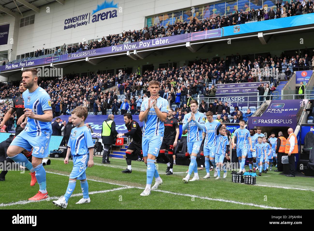 Coventry City's Matthew Godden (left) walking onto the pitch before the ...
