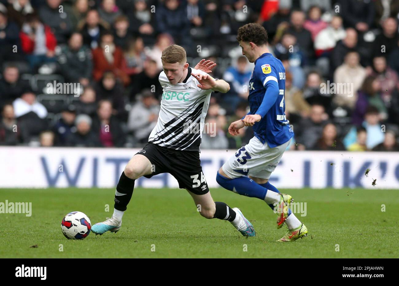Derby County's Jake Rooney (left) and Ipswich Town's Nathan Broadhead ...