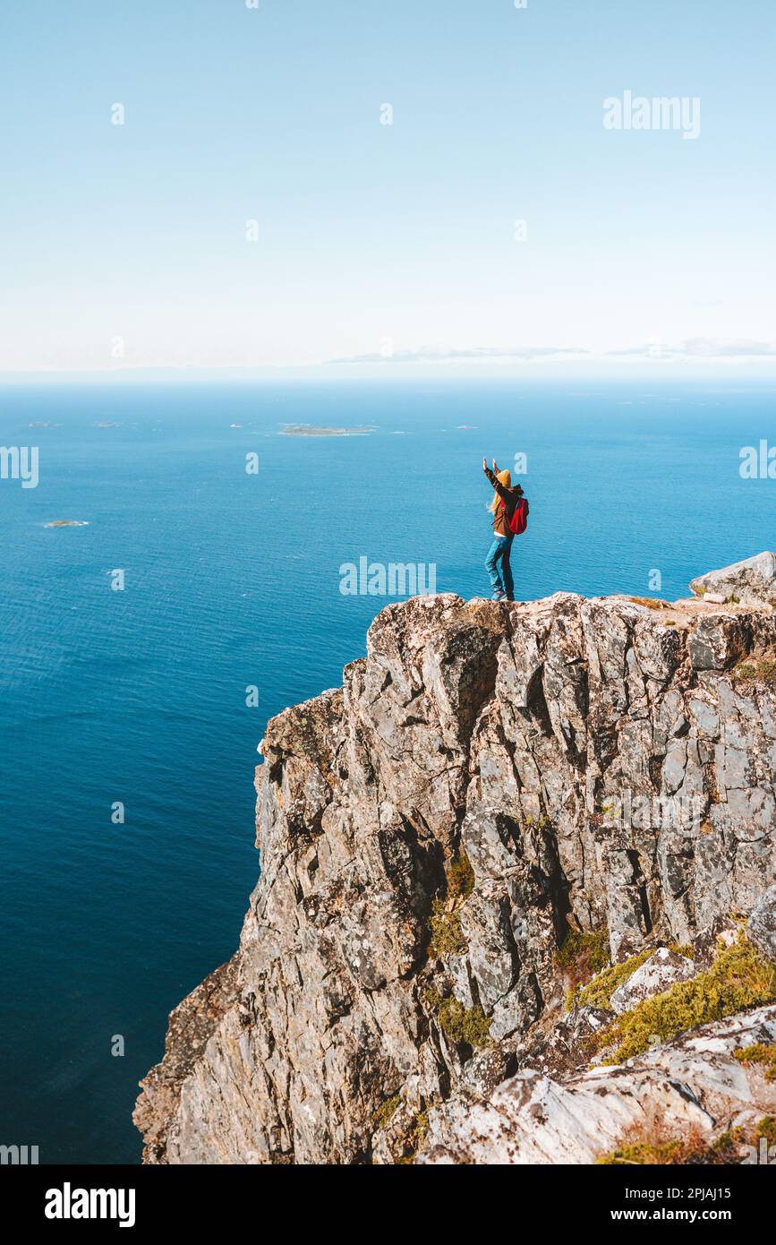 Travel in Norway woman on the edge cliff adventure active lifestyle vacations hiking outdoor ...