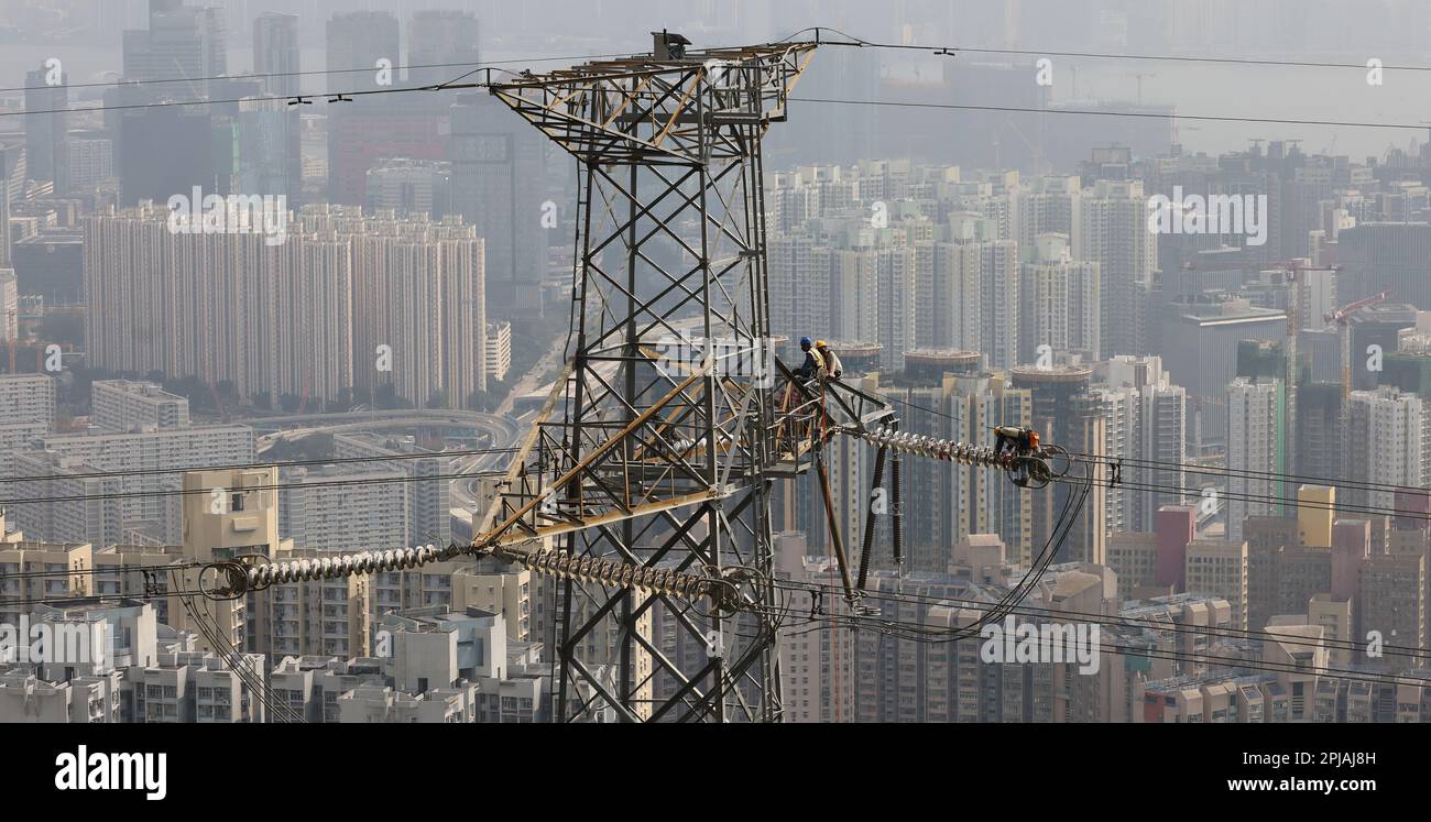 Workers repair faulty electricity tower near Shatin Pass Road ...