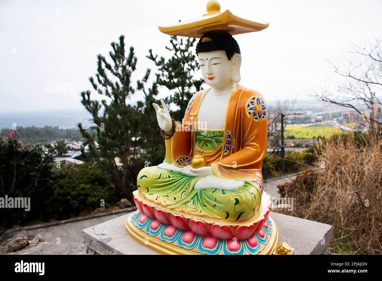 Colorful chinese god figure and deity angel buddha statue on stone ...