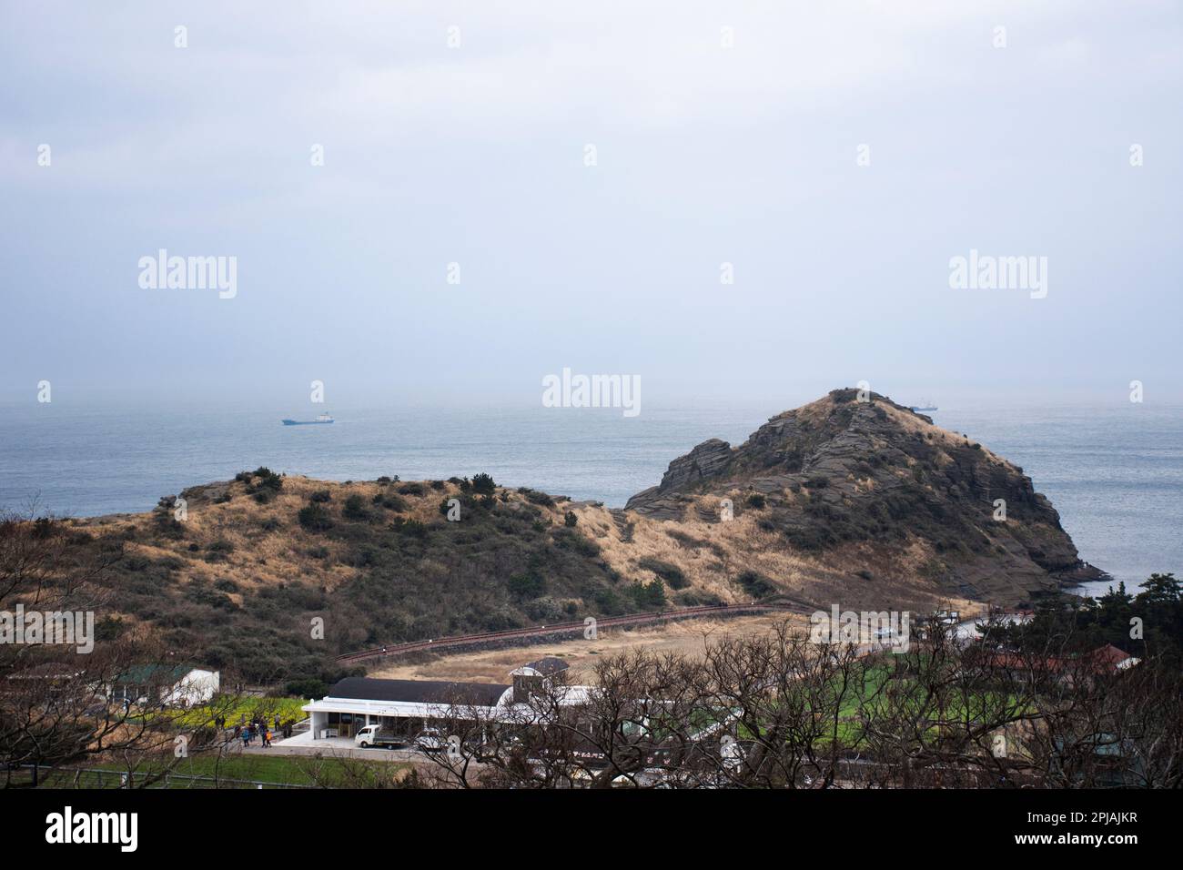 View landscape jeju island and seascape sea ocean with cityscape ...