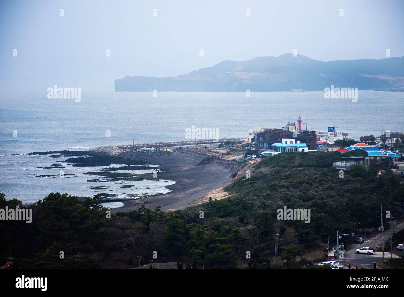 View landscape jeju island and seascape sea ocean with cityscape ...