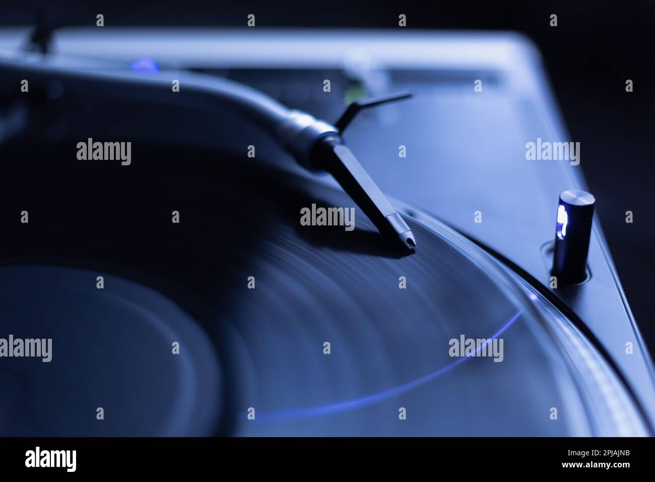 Vinyl record player needle plays music from analog disc. Listen to ...