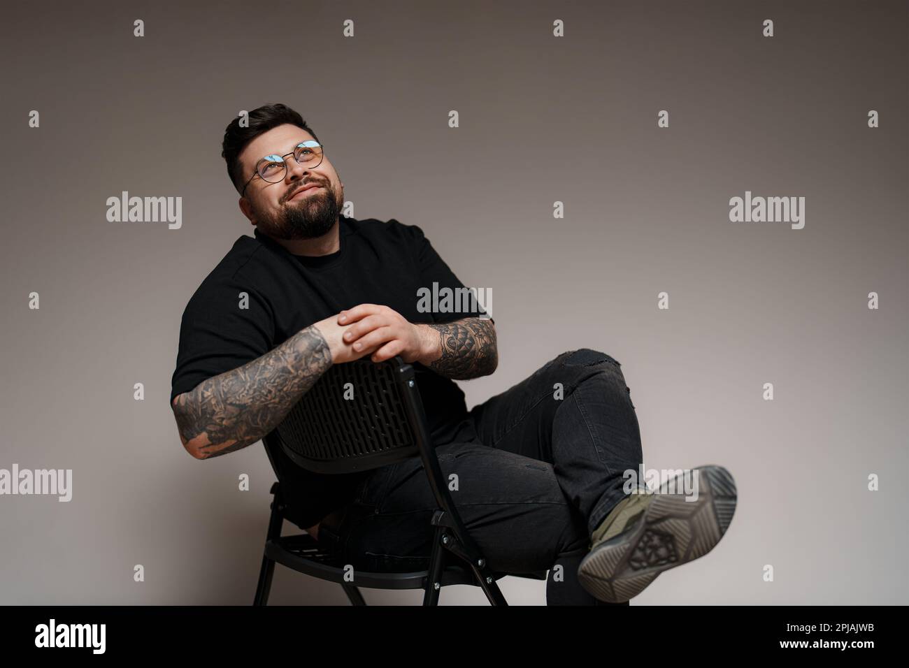 Overweight man sitting on chair hi-res stock photography and images - Alamy