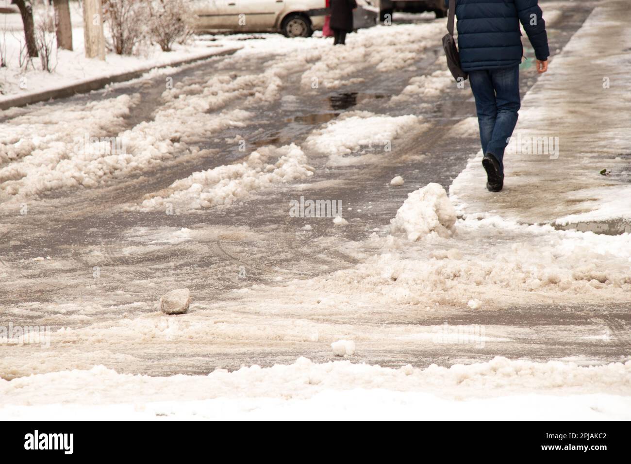 frozen snow from ice on a city street in winter in Ukraine Stock Photo ...