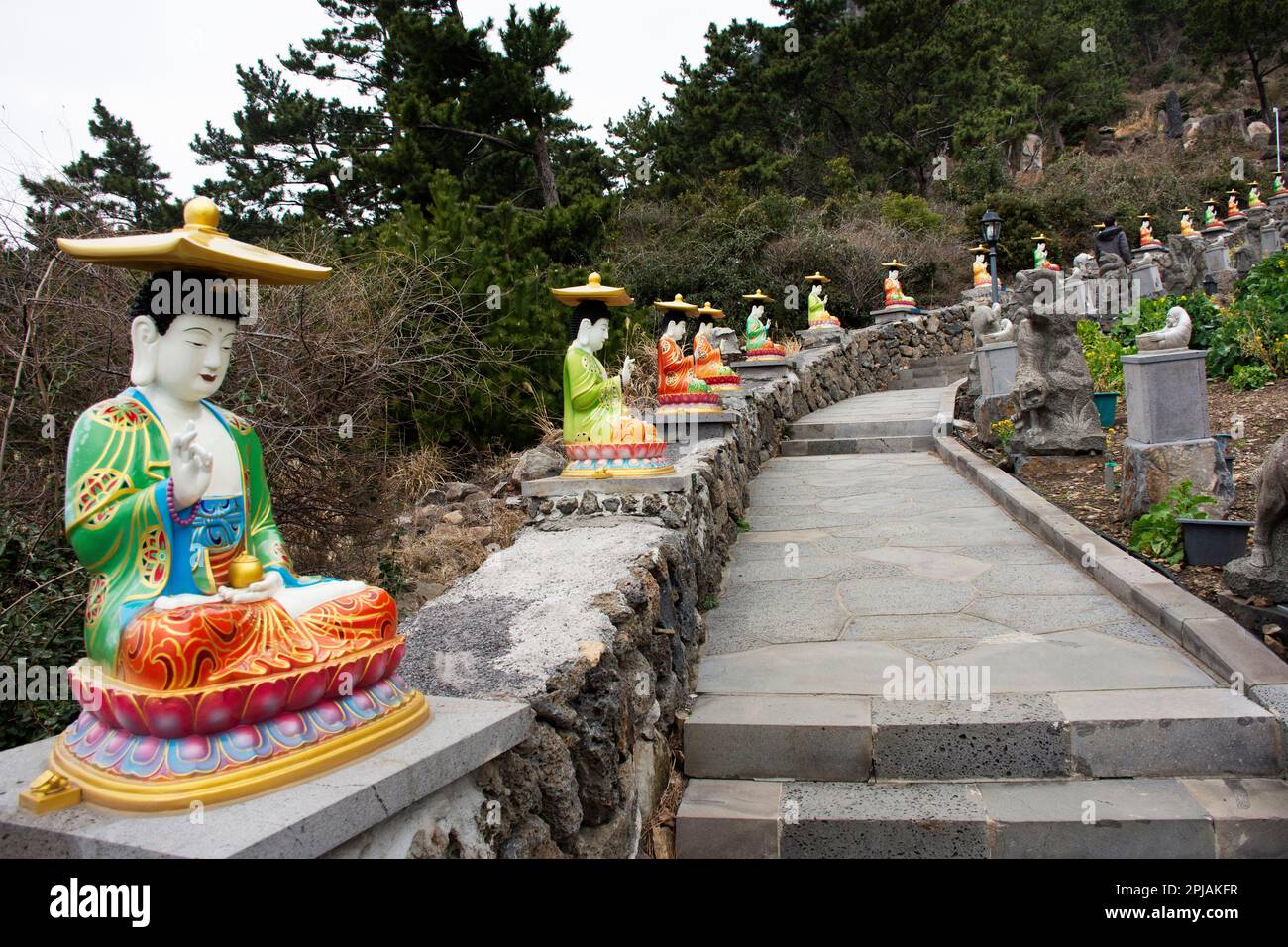 Colorful chinese god figure and deity angel buddha statue on stone ...