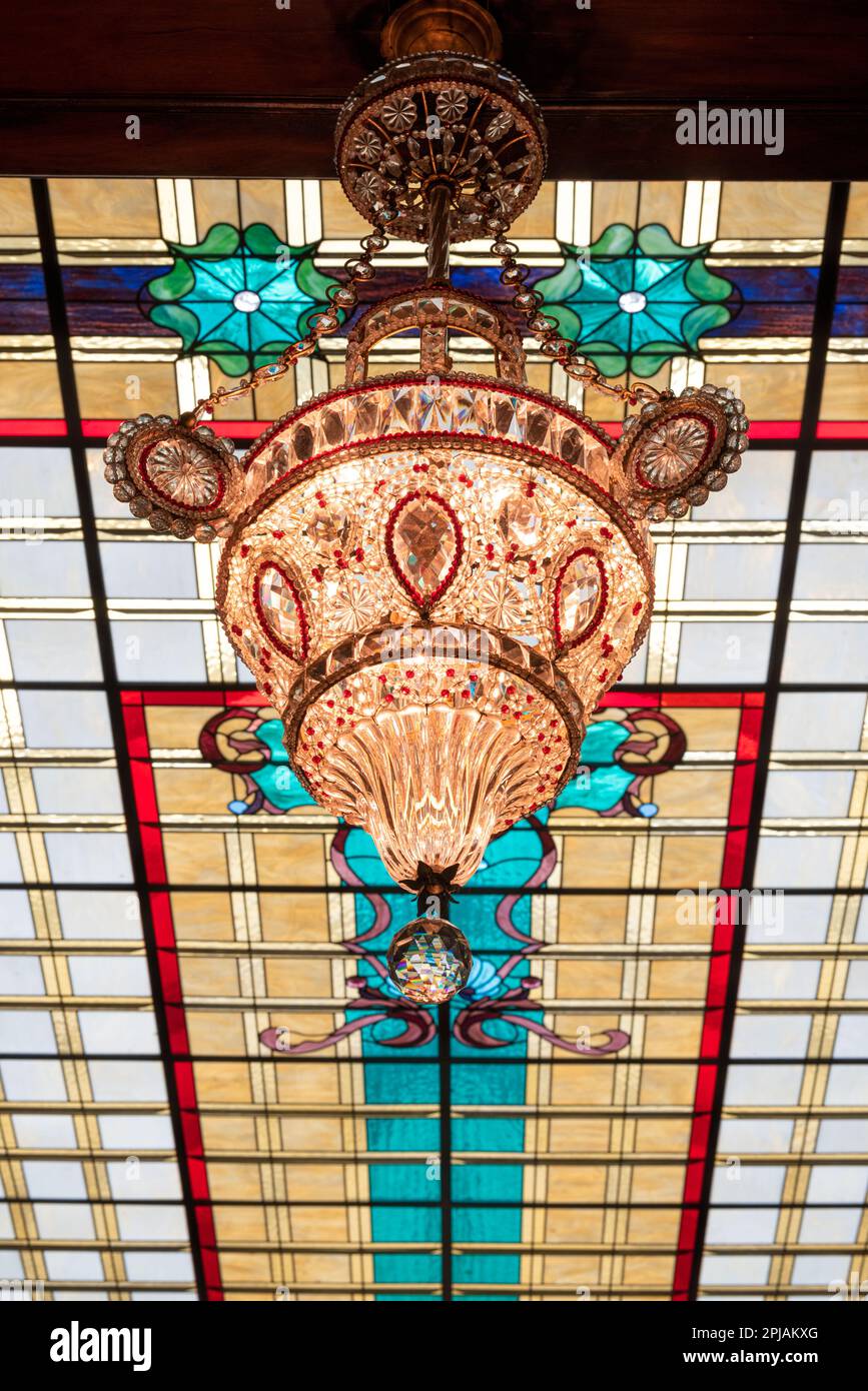 Chandelier and stained glass ceiling in the historic Geiser Grand Hotel ...