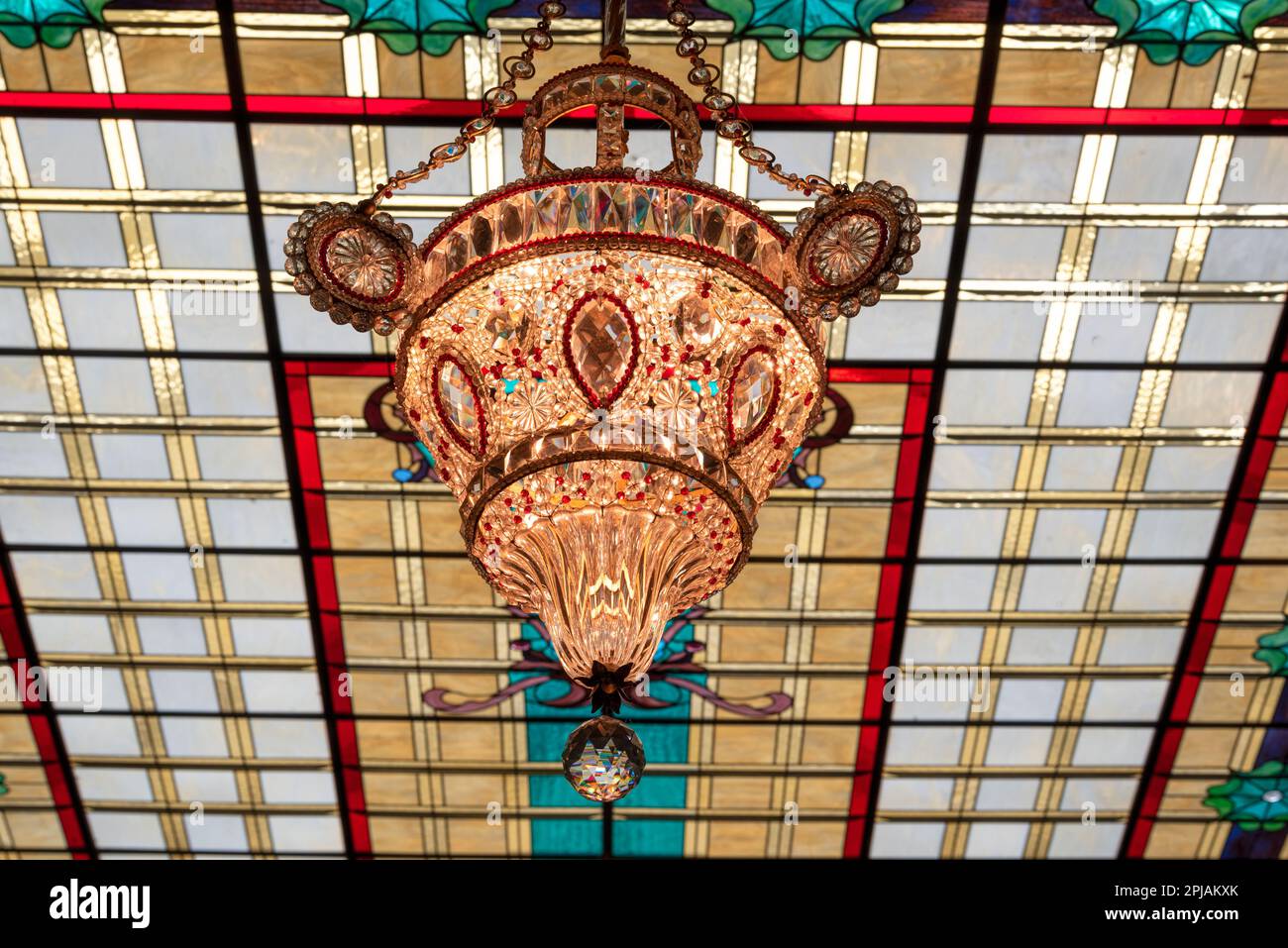 Chandelier and stained glass ceiling in the historic Geiser Grand Hotel ...