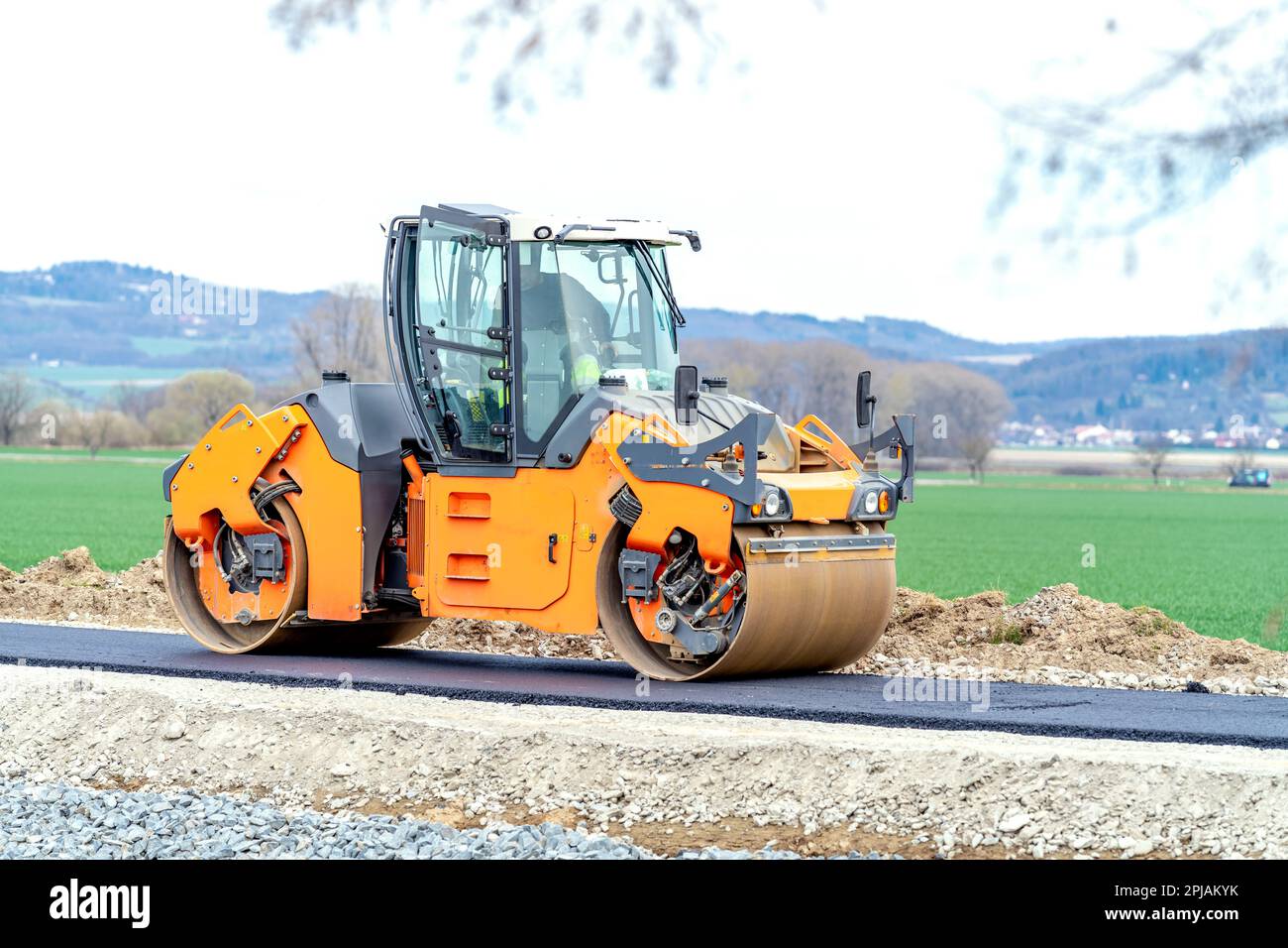 roller for asphalt compaction during the construction of a new road and ...